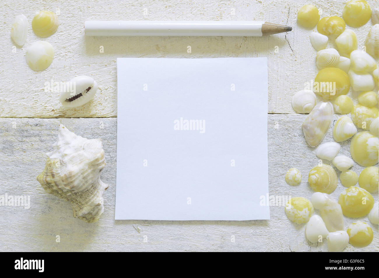 A pen ready to take notes on a white wooden table decorated with some ...