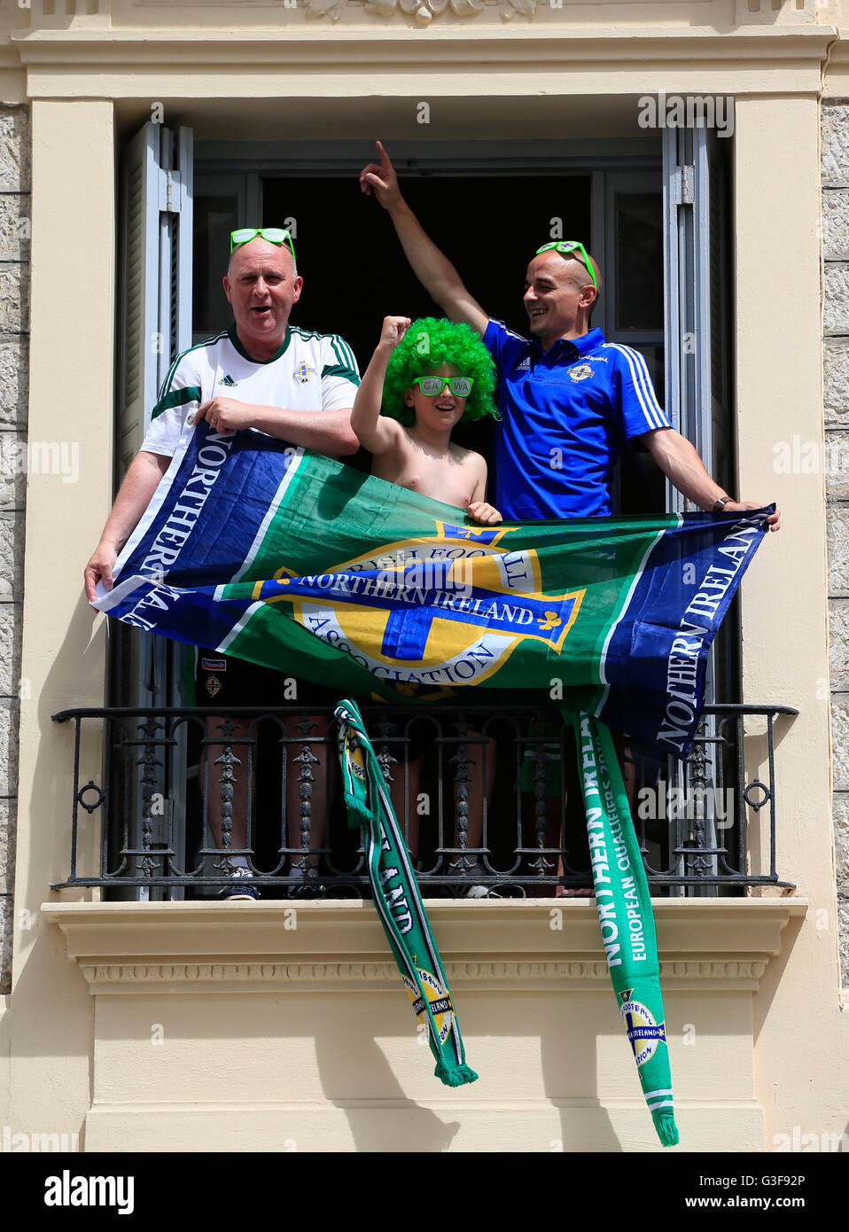 Northern Ireland fans appear on the balcony of their hotel on the ...