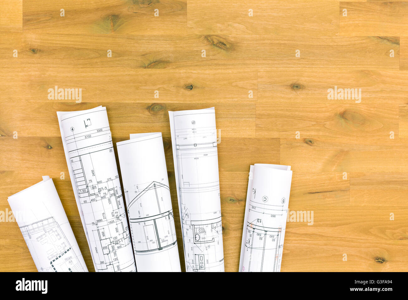 architect's workspace with rolled house plans and blueprints Stock ...