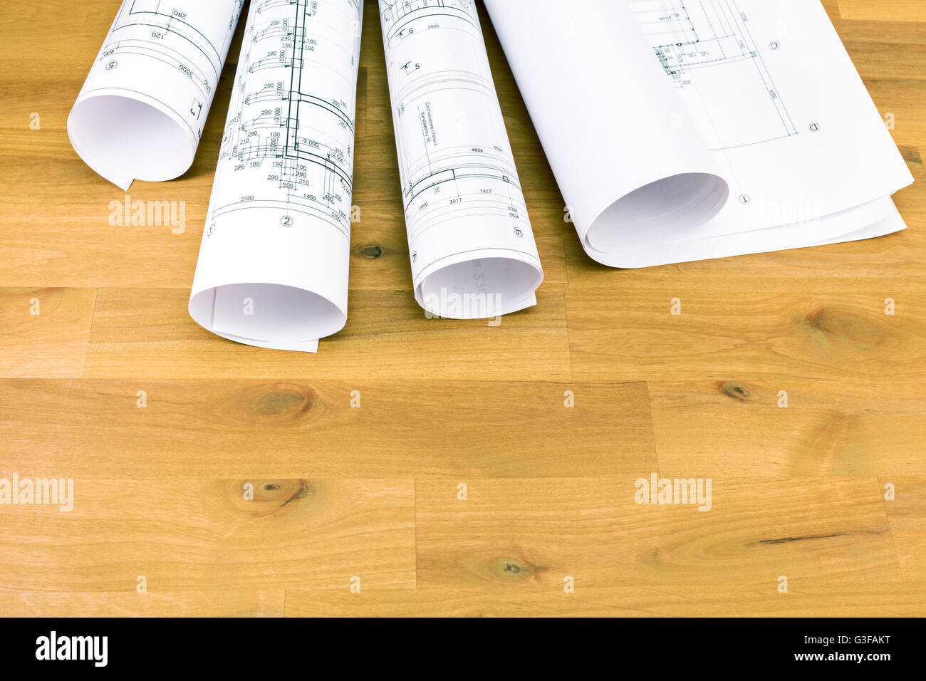 architect's workspace with rolled blueprints and house plans Stock ...