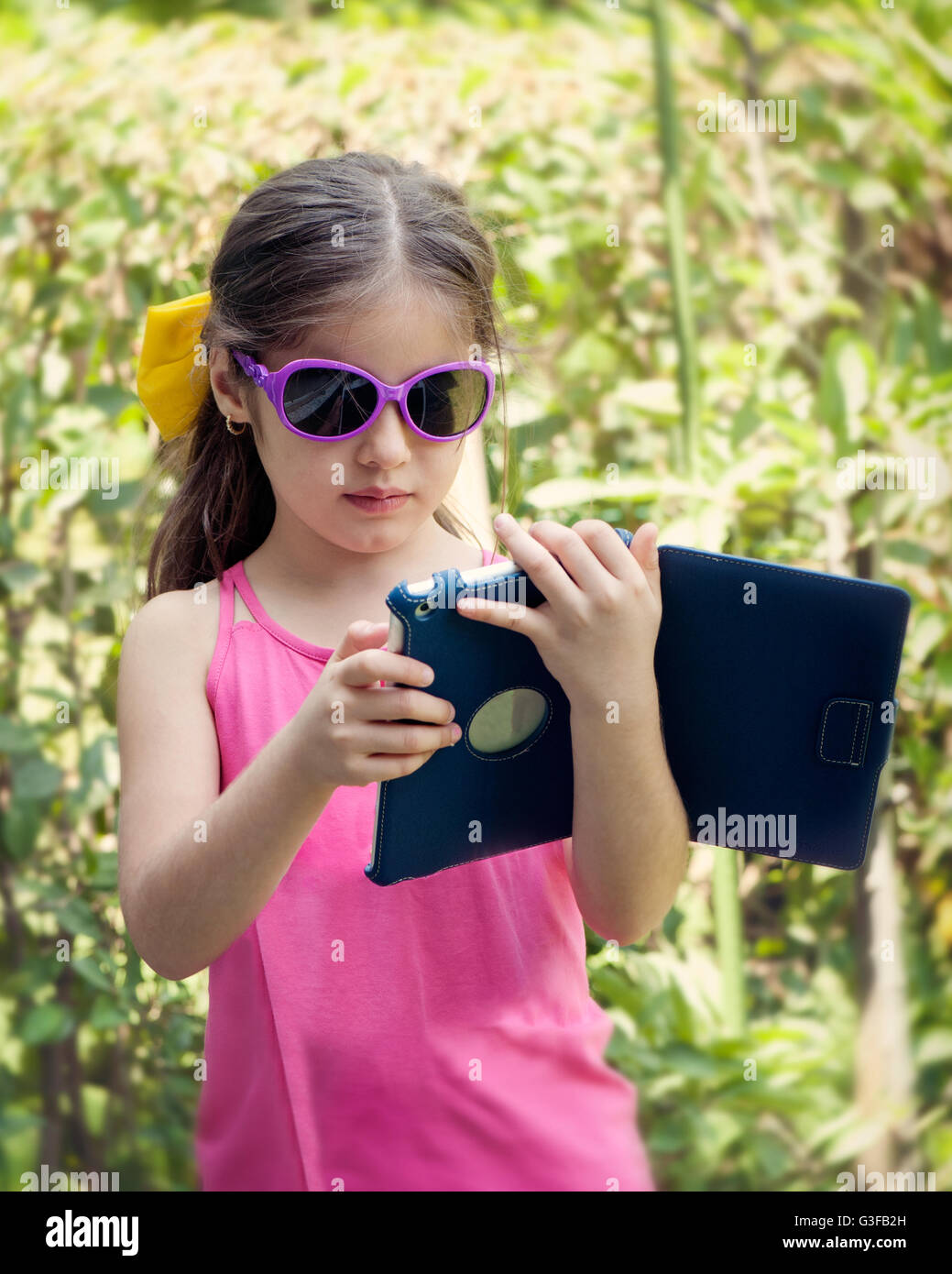 Girl using tablet Stock Photo - Alamy
