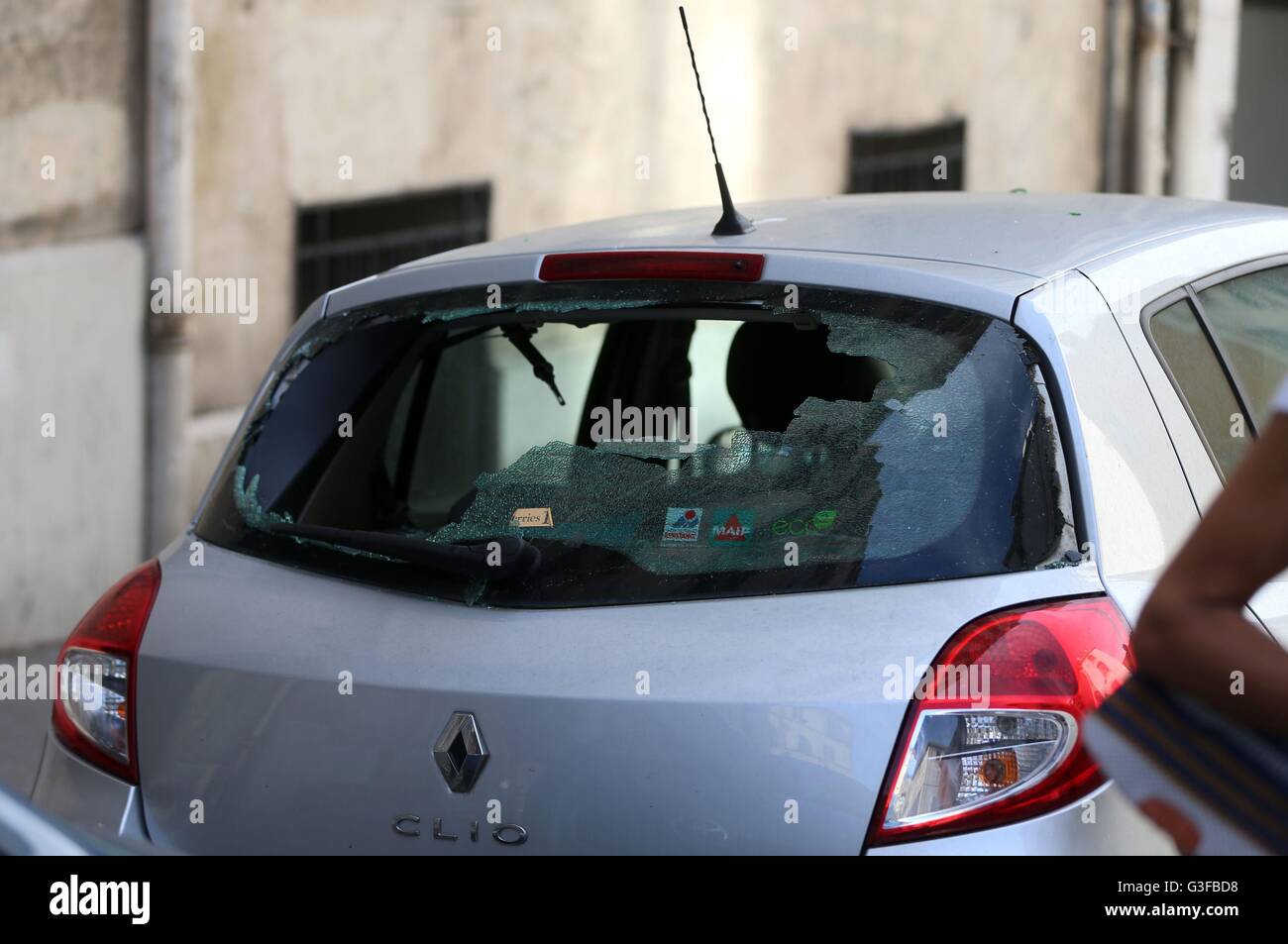 A smashed car window after football fans clashed ahead of the England ...