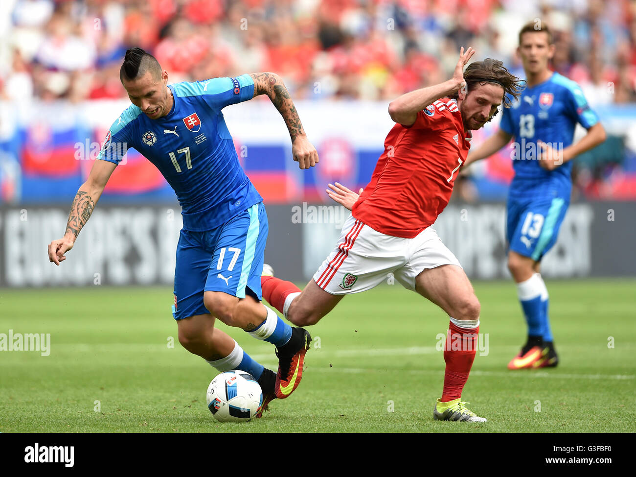 Wales Joe Allen (right) and Slovakia's Marek Hamsik battle for the ball ...