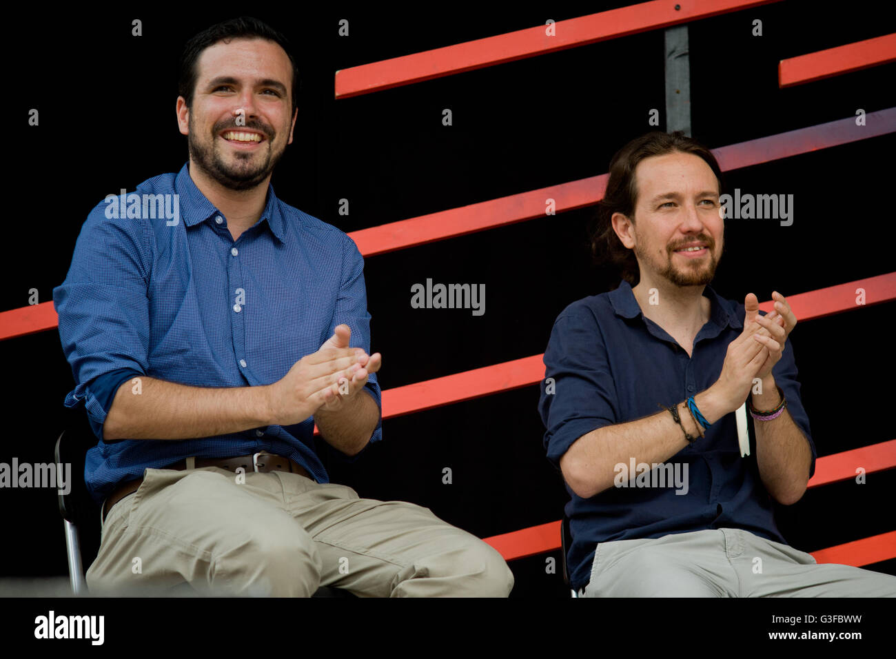 Leader of Podemos Pablo Iglesias (R) and United Left (IU) leader ...
