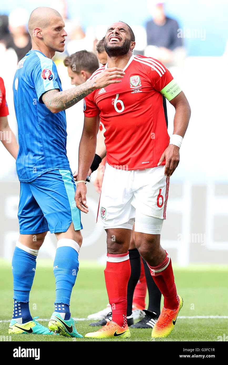 Wales' Ashley Williams (right) reacts after suffering an injury during ...