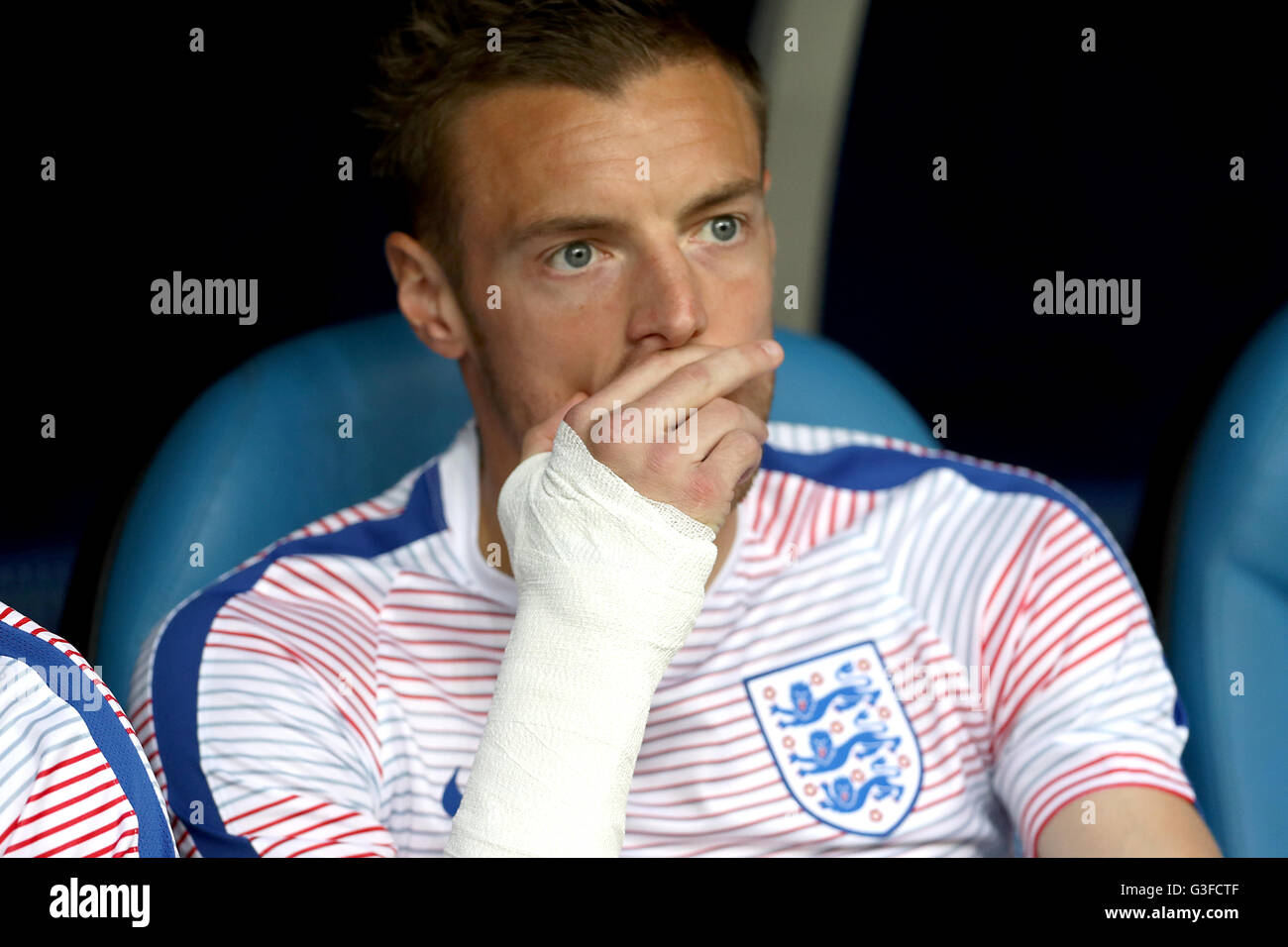 England's Jamie Vardy looks on from the substitutes bench before kick ...