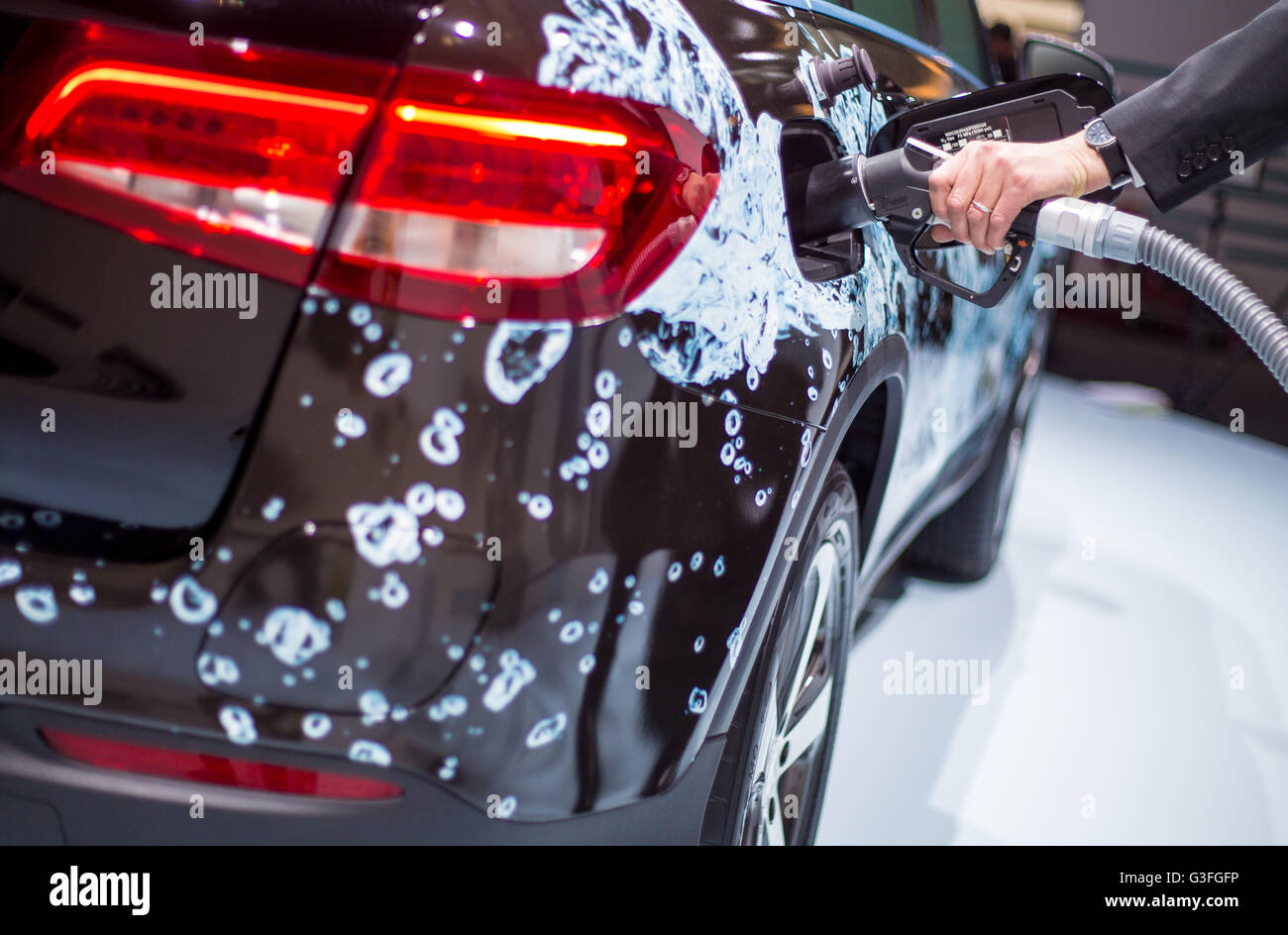Stuttgart, Germany. 9th June, 2016. A man refuelling a Mercedes-Benz F ...