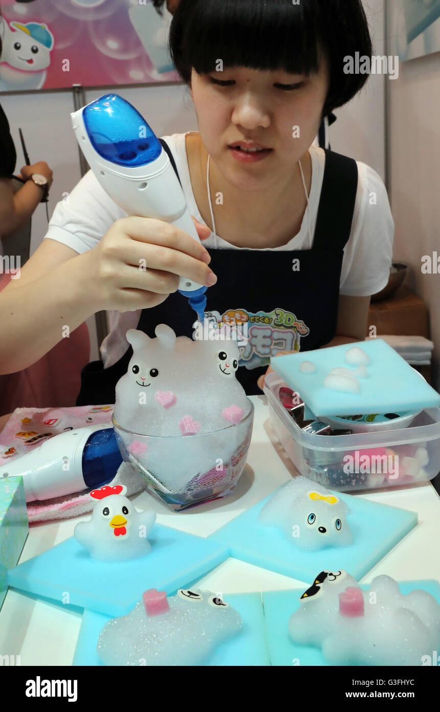 Tokyo, Japan. 10th June, 2016. An employee of Japanese toy maker Shine ...