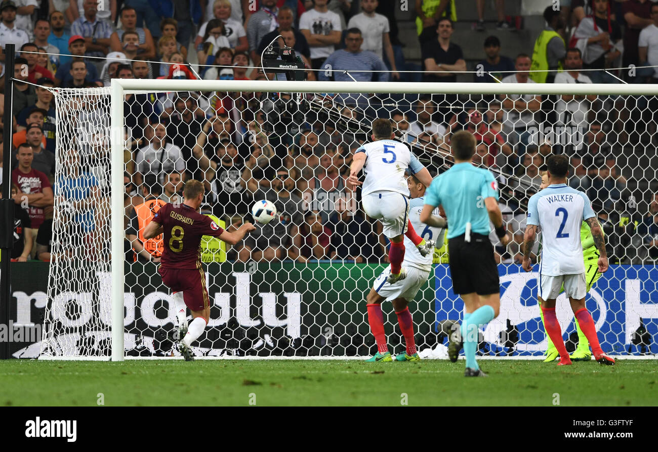 Denis Glushakov (L) of Russia scores 1-1 equalizer during the UEFA Euro ...