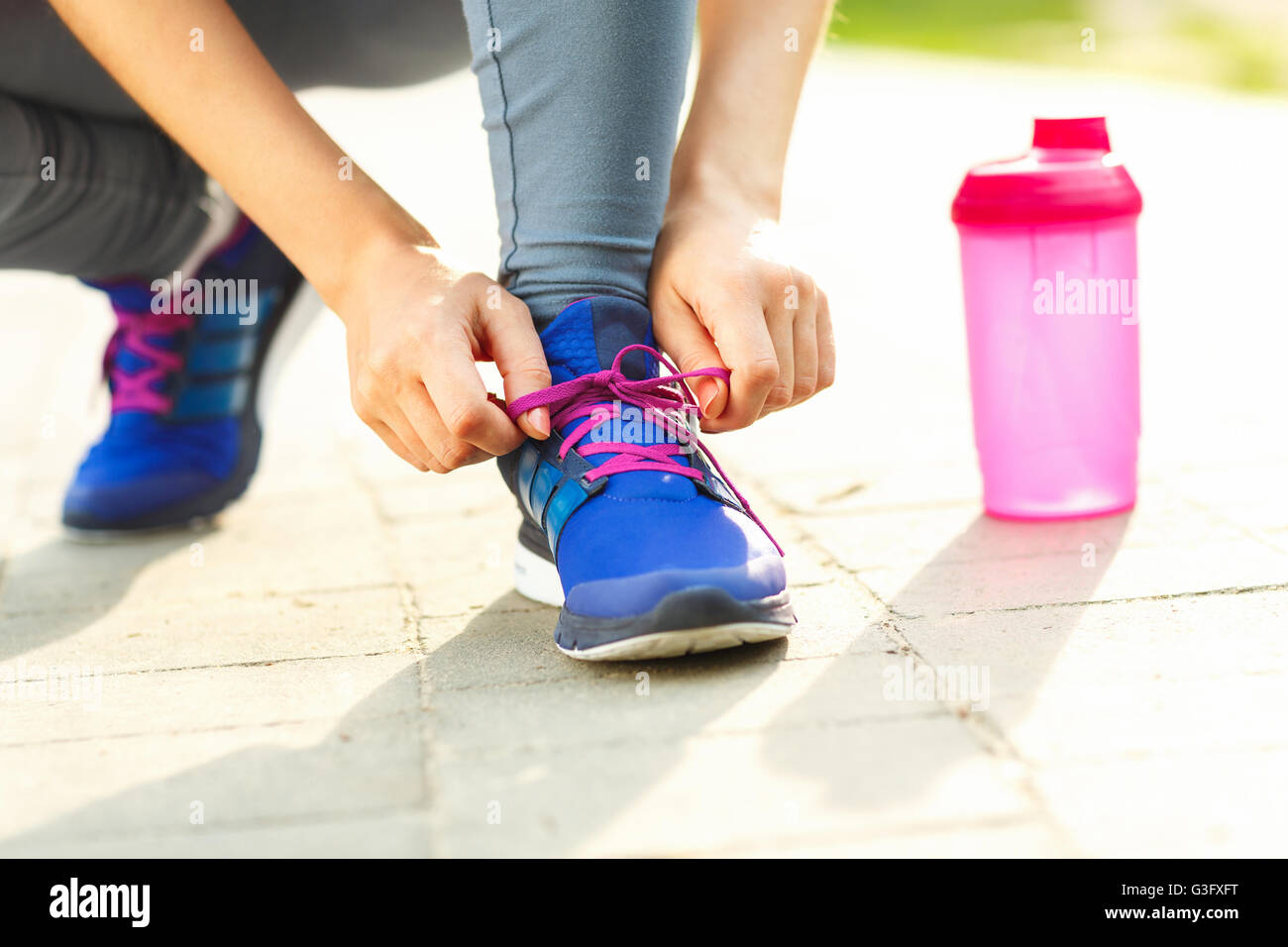 Runner is tying shoes hi-res stock photography and images - Alamy