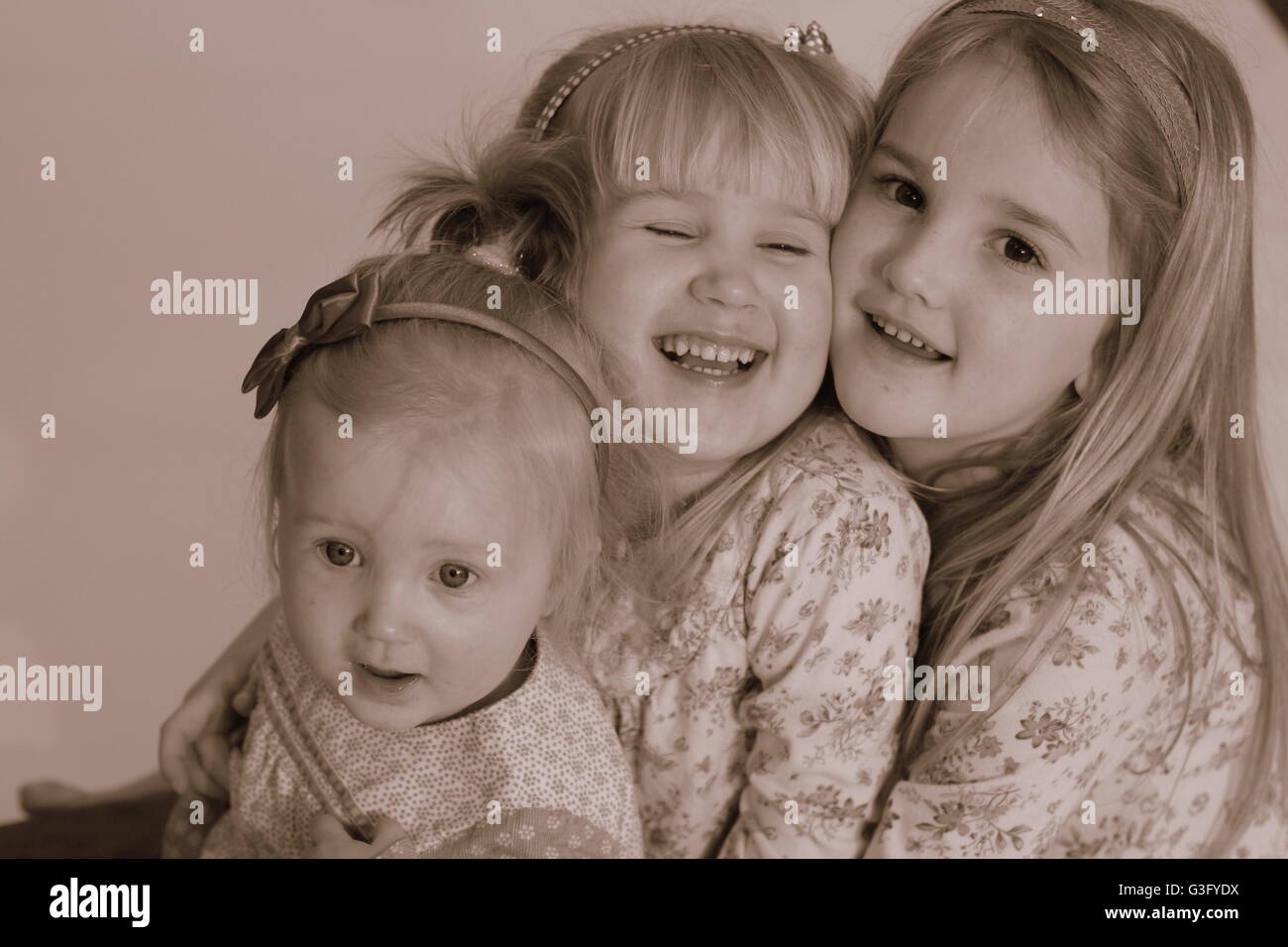 Children cuddling together laughing out loud in pure joy, Children ...