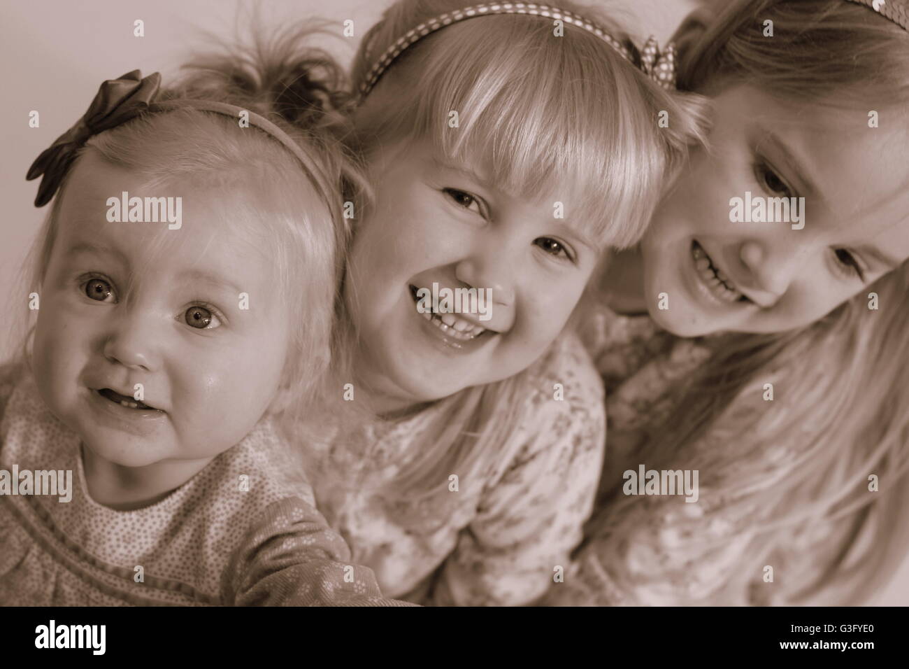 Blonde Children, kids girls cuddling together laughing out loud in pure ...