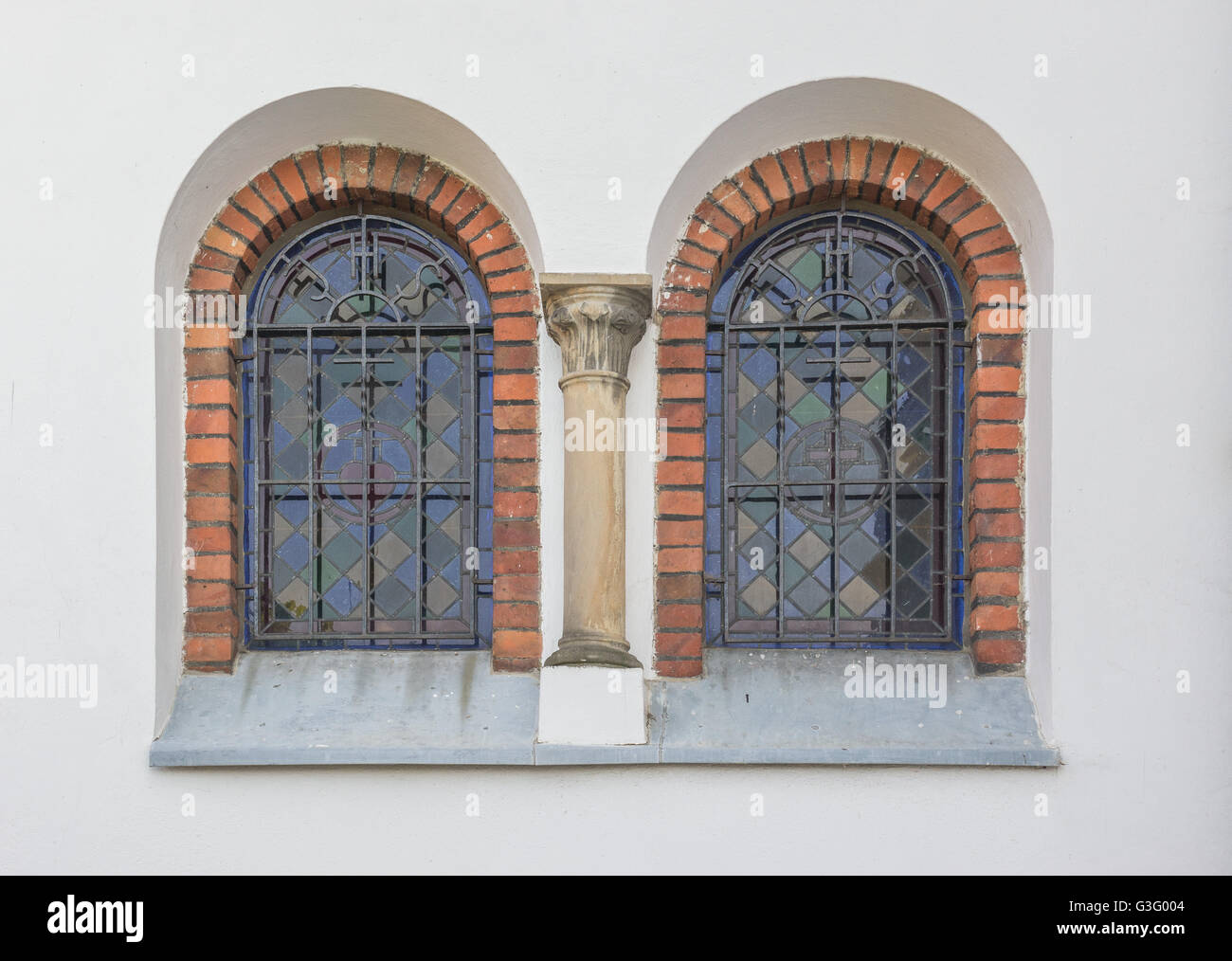 Two romanesque windows with stained glass village church in Smialowice ...