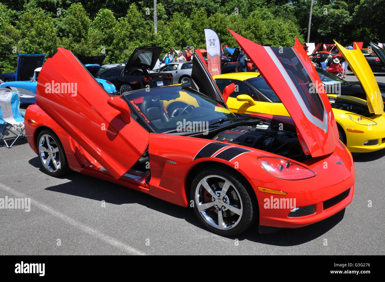 A red Corvette C6 Convertible with vertical swinging doors Stock Photo ...
