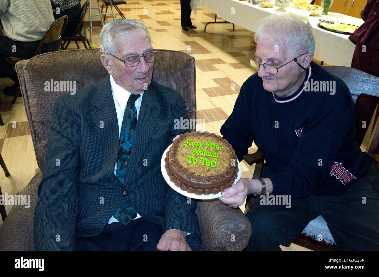 Elderly man presenting Ted age 95 his birthday cake. Redwood Falls ...