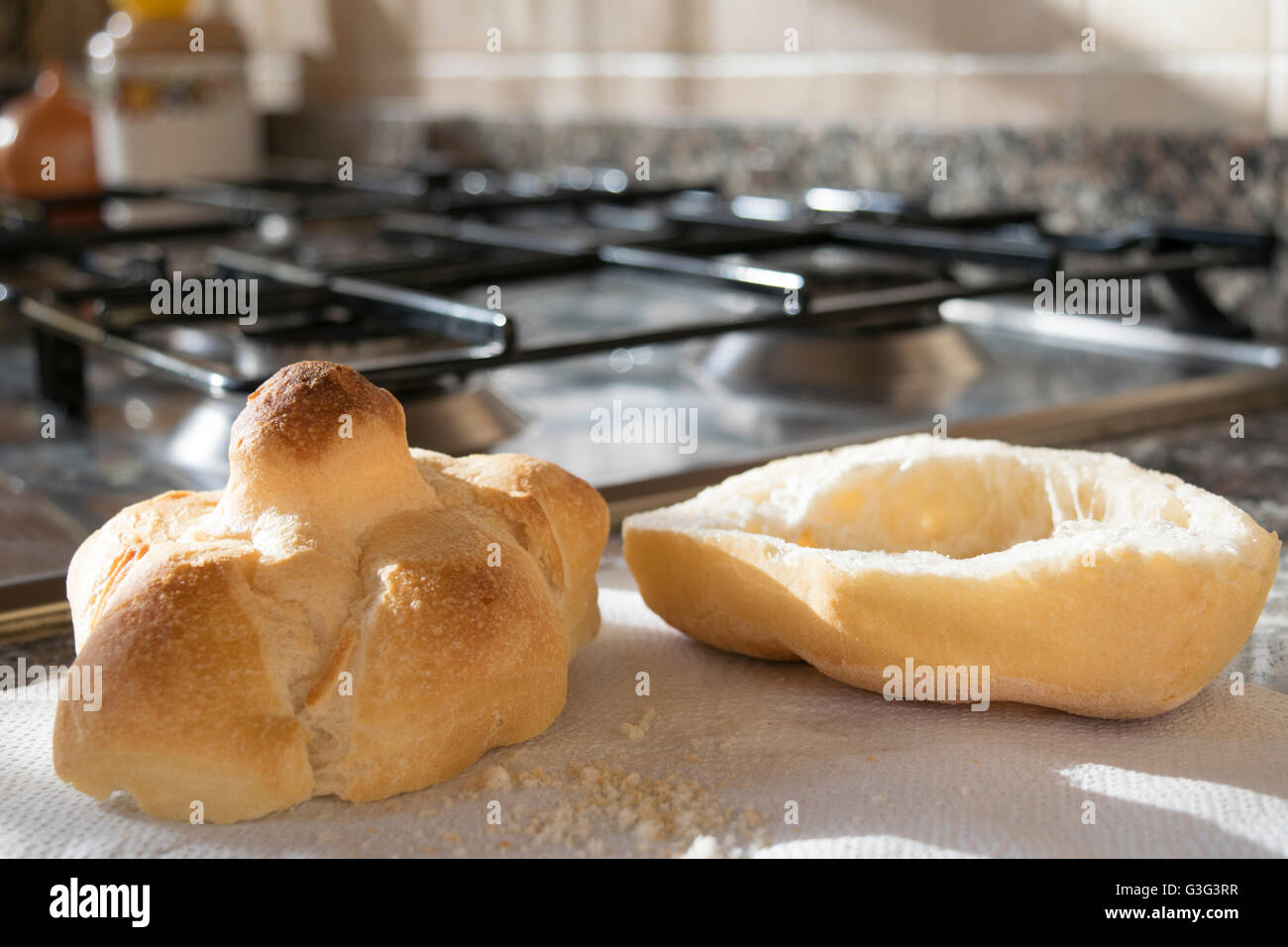 bread roll half cut with on a stove-top Stock Photo - Alamy