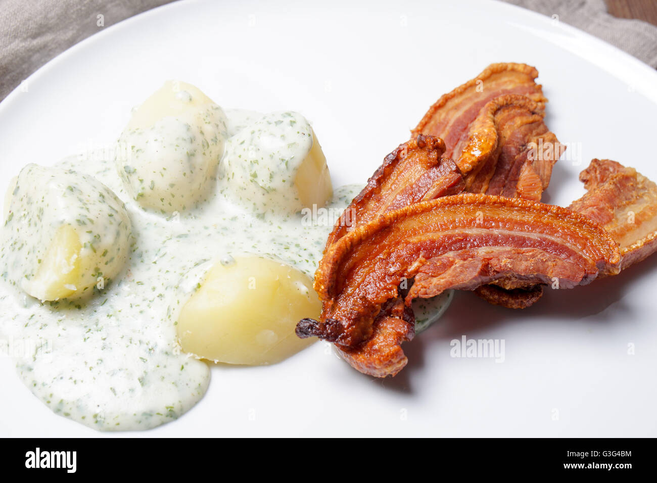 Denmark's national dish fried pork belly with parsley sauce and ...