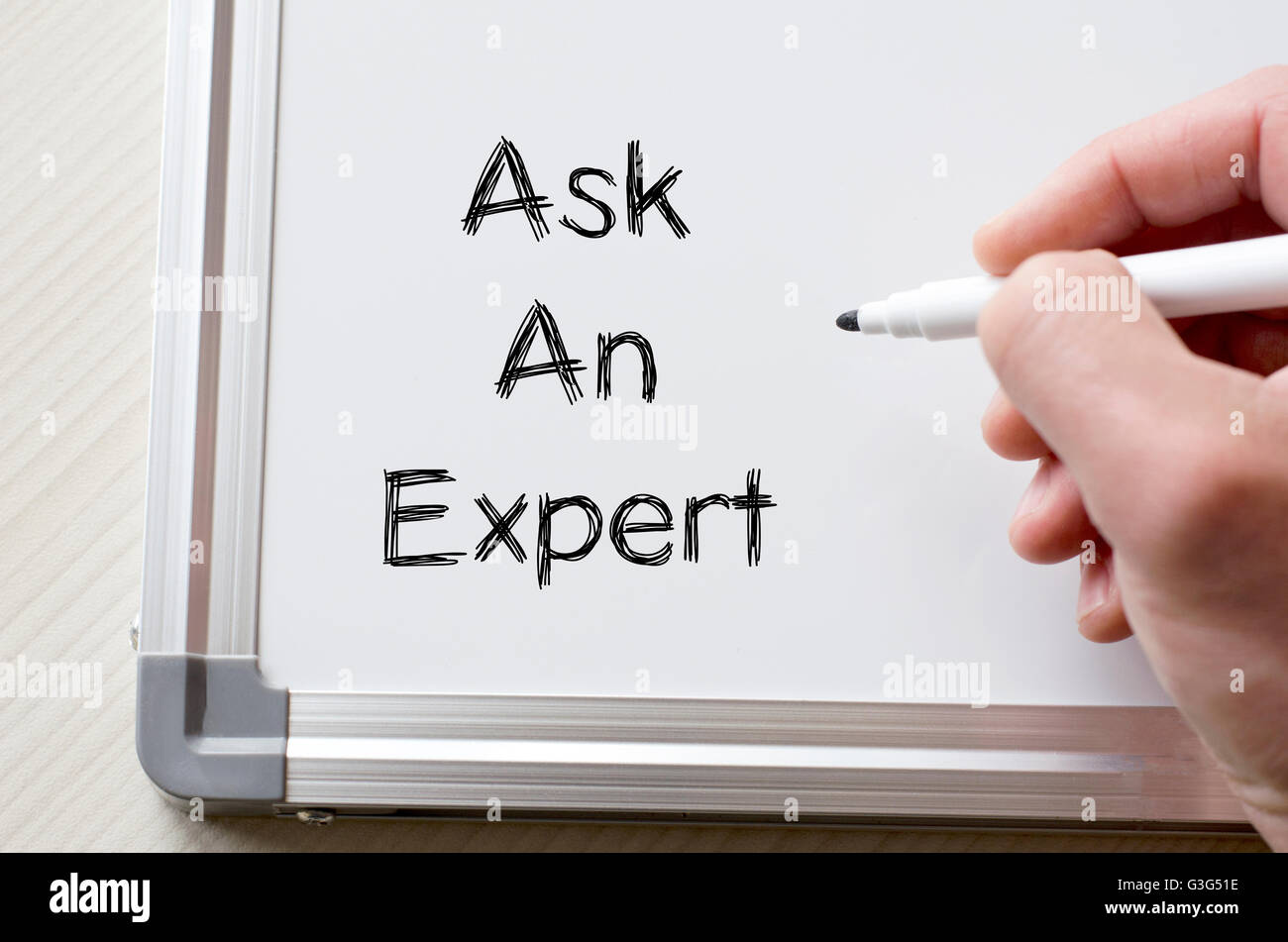 Human hand writing ask an expert on whiteboard Stock Photo - Alamy