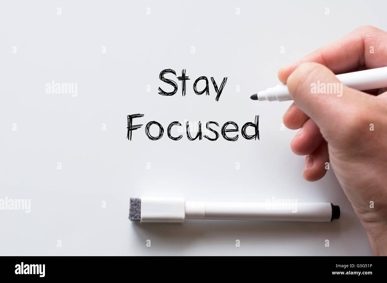 Human hand writing stay focused on whiteboard Stock Photo - Alamy