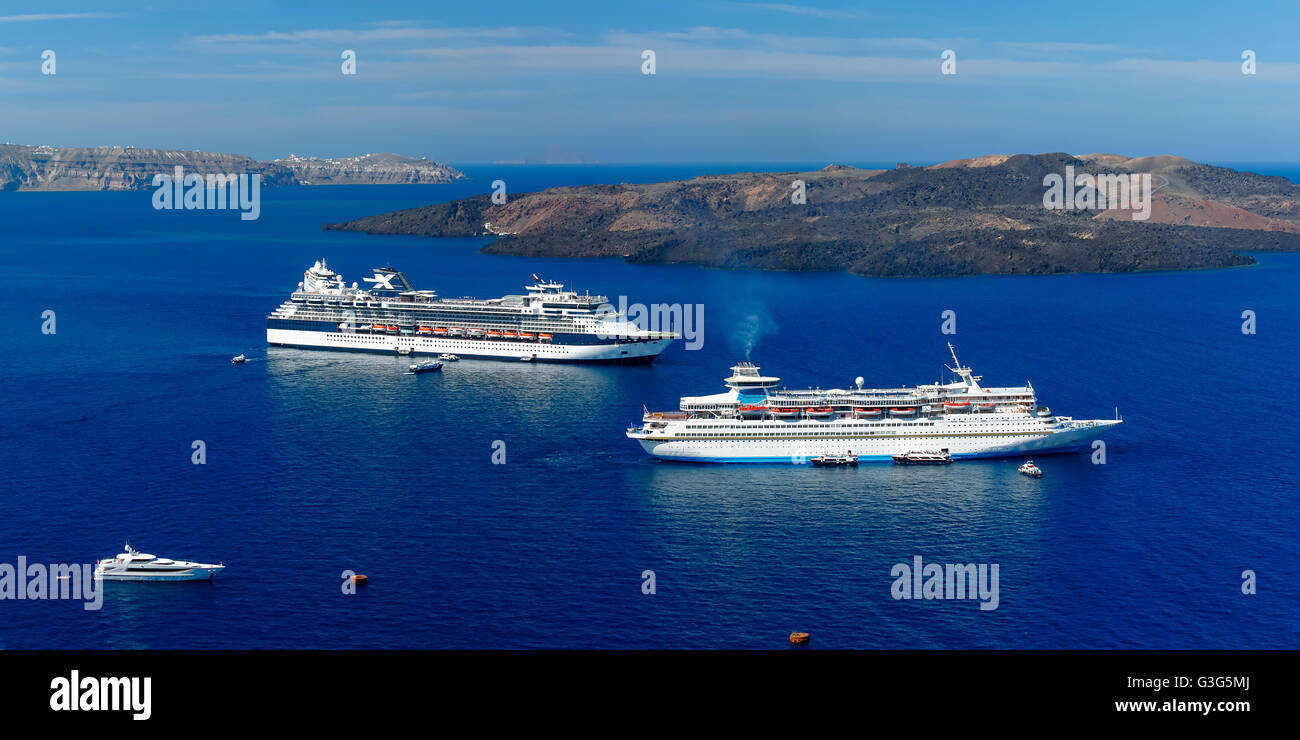Luxury cruise ships, caldera and volcano near Fira, modern capital of ...