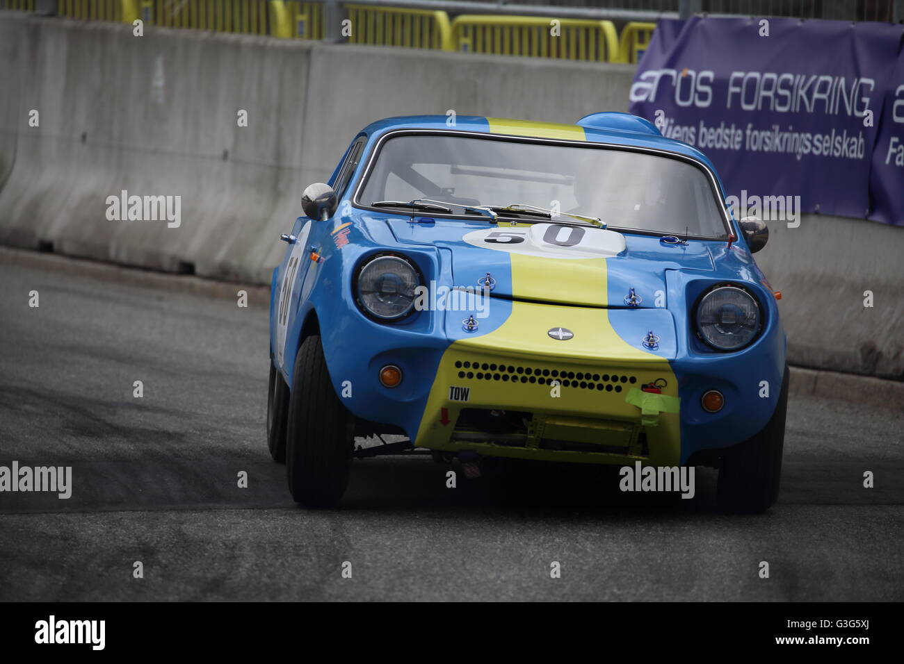 A 1967 Marcos Mini GT being raced at the 2016 Aarhus Classic Car Race ...