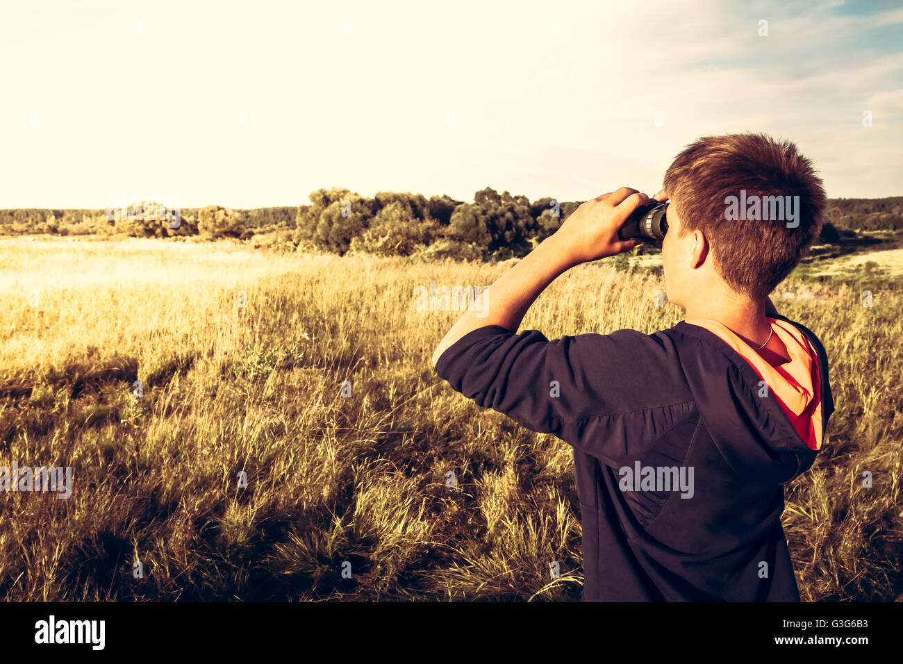 Boy searching for an adventure Stock Photo - Alamy