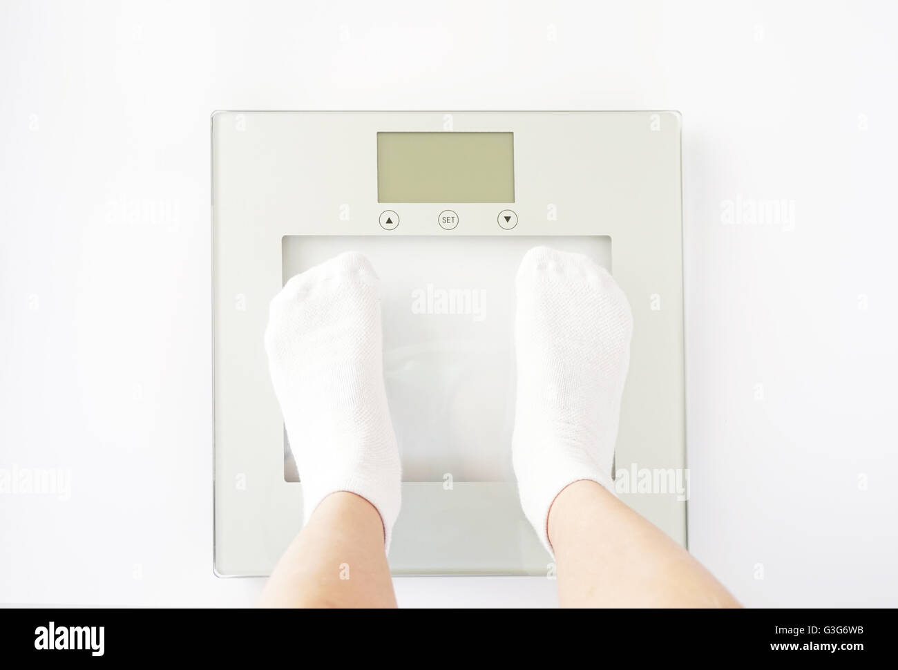 Child standing on scale hi-res stock photography and images - Alamy