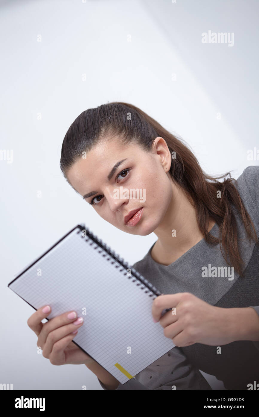 Business lady with a notepad in the office Stock Photo - Alamy