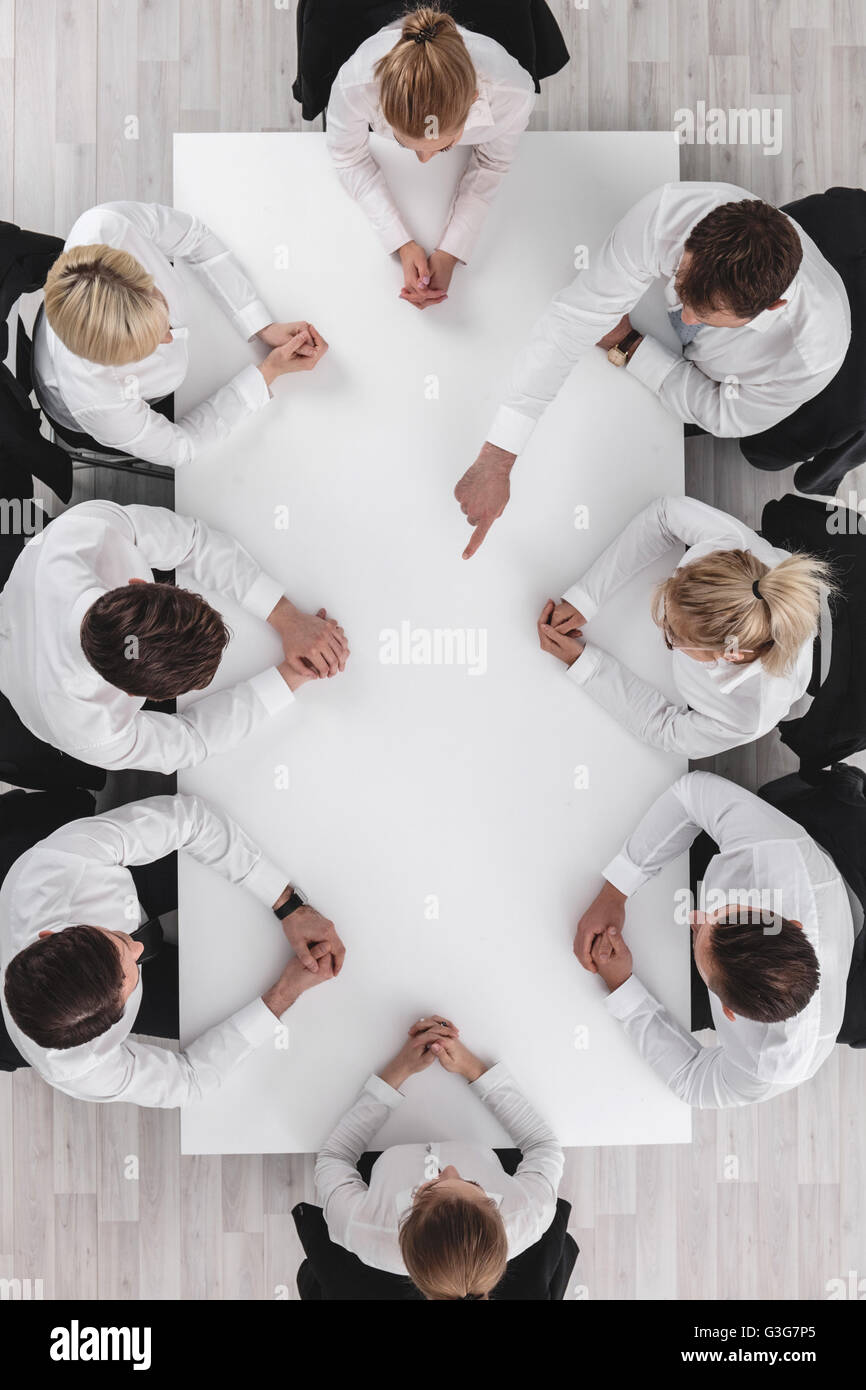 Diverse business people sitting around the table on a meeting Stock ...