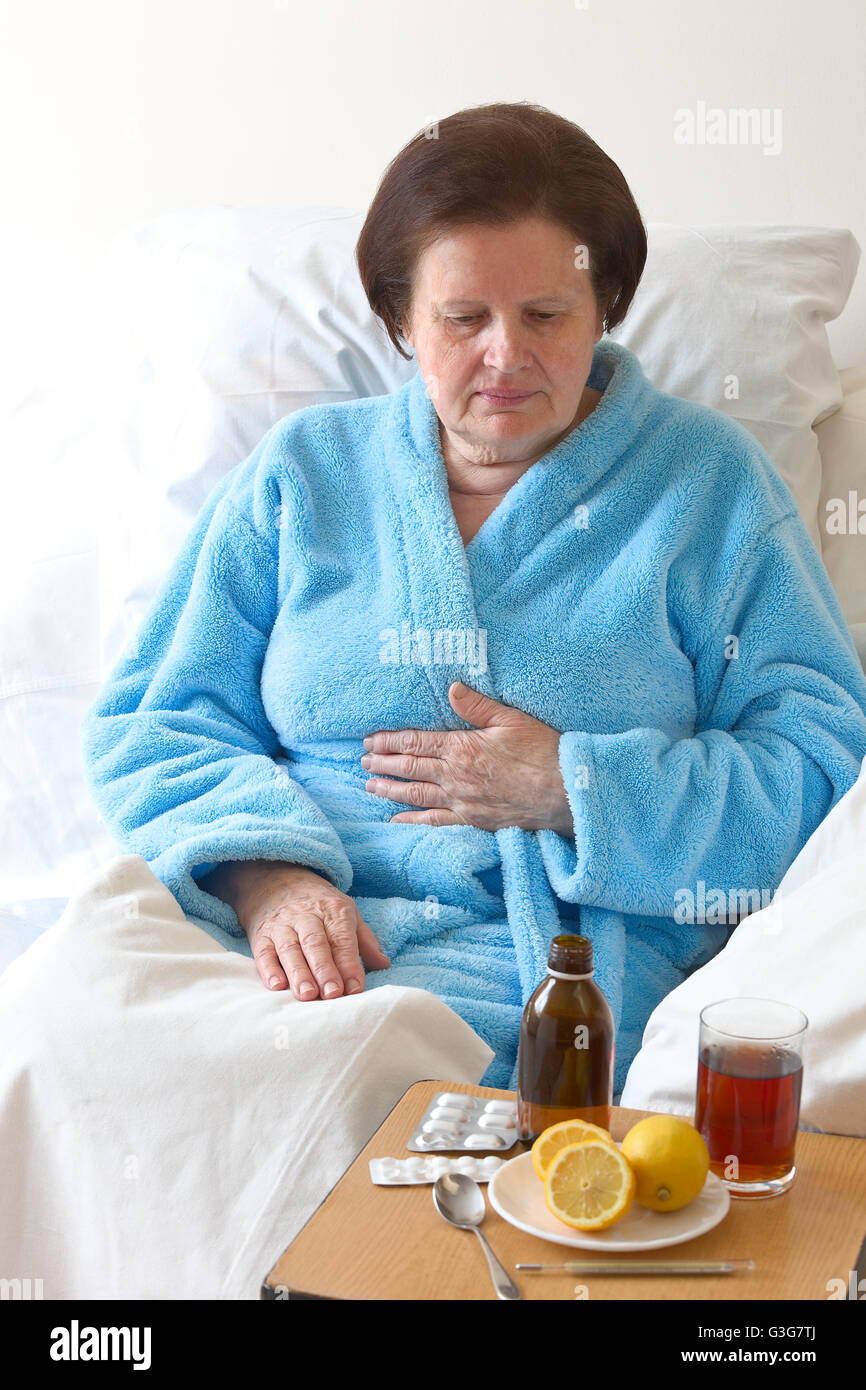 Woman stomach ache bed hi-res stock photography and images - Alamy