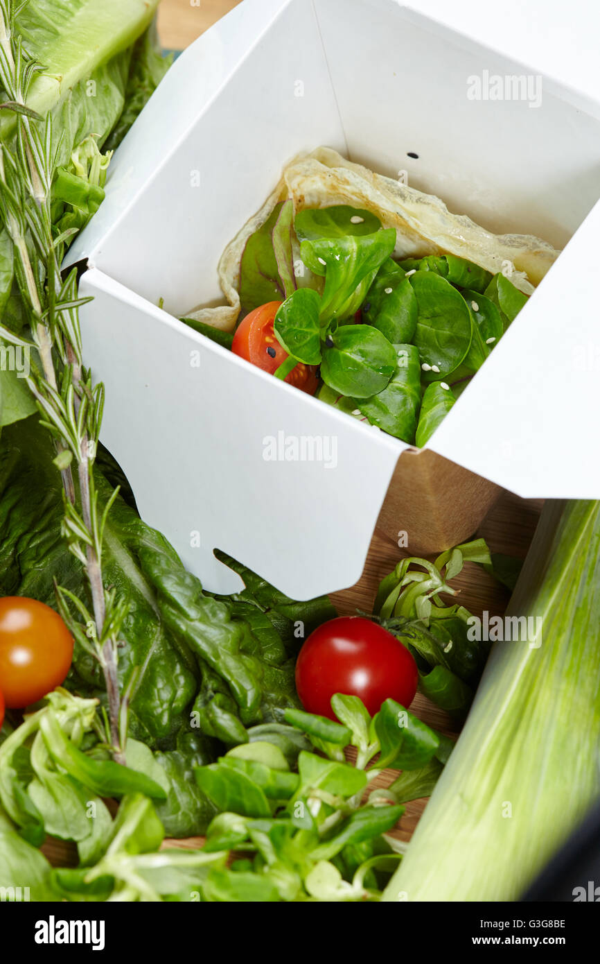 vegetarian vegan vegetable dish, fresh herbs in a cardboard box Stock ...