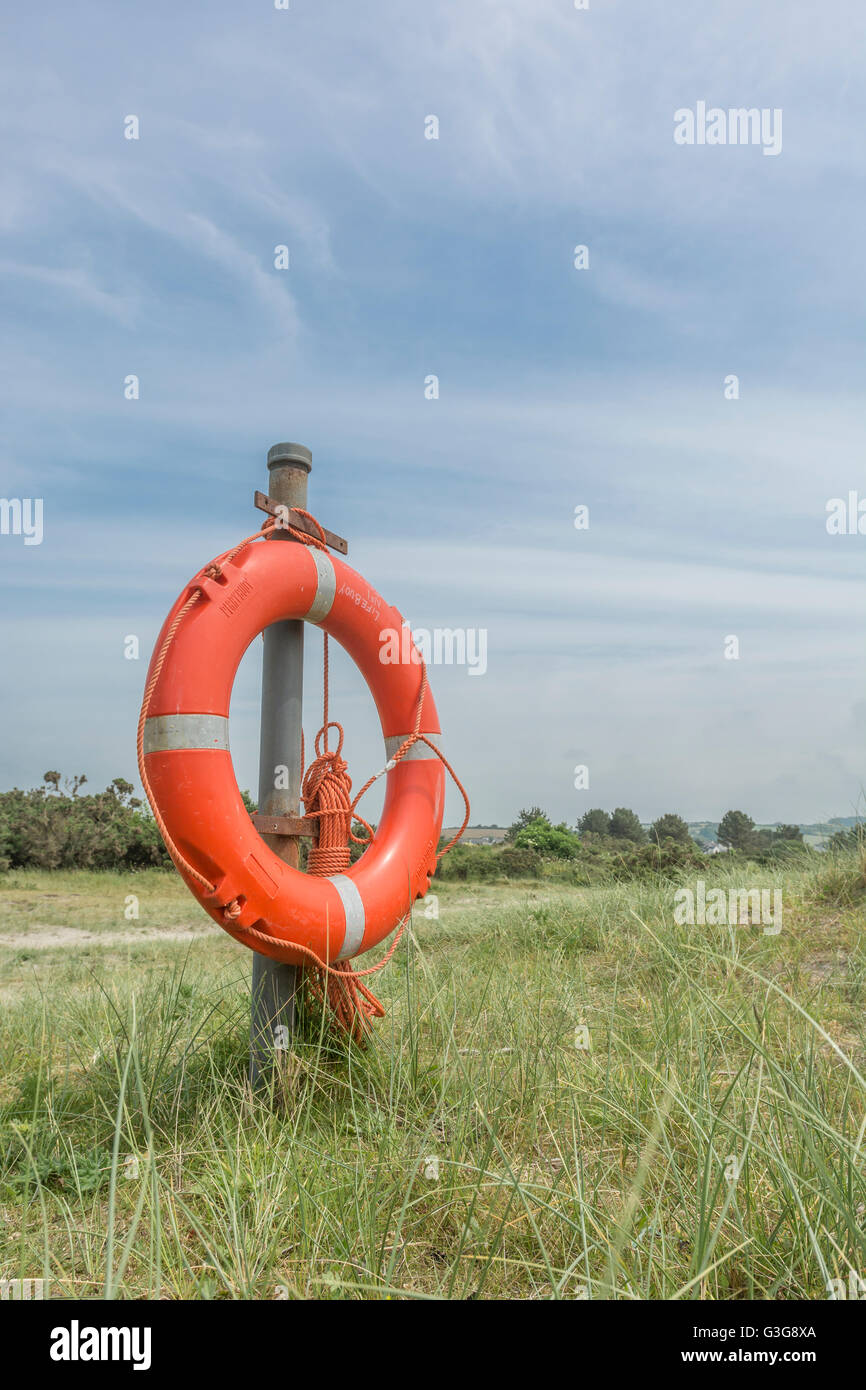 Orange lifebuoy, life buoy ring - visual metaphor for concept of danger ...