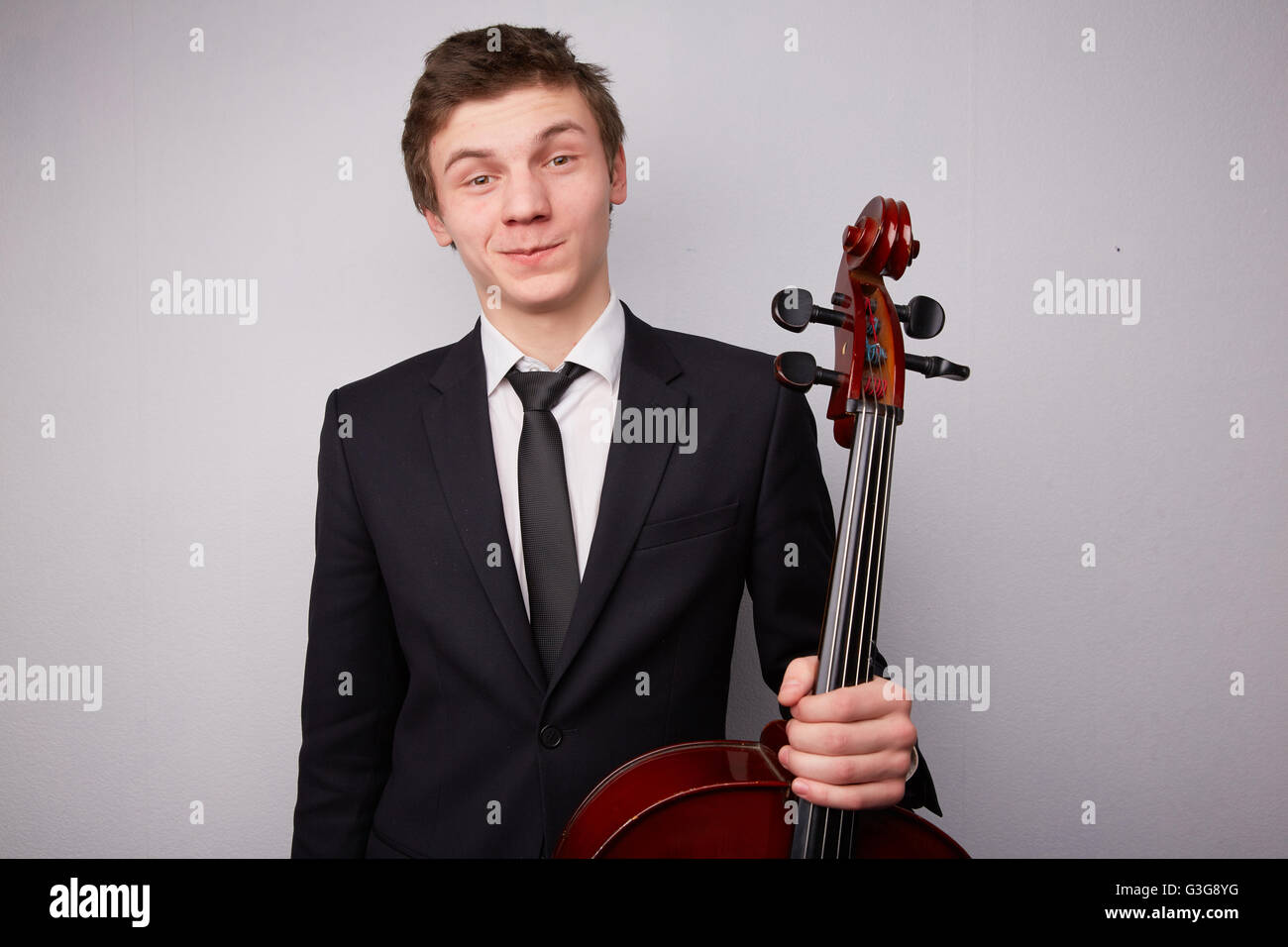 young man with a cello Stock Photo - Alamy