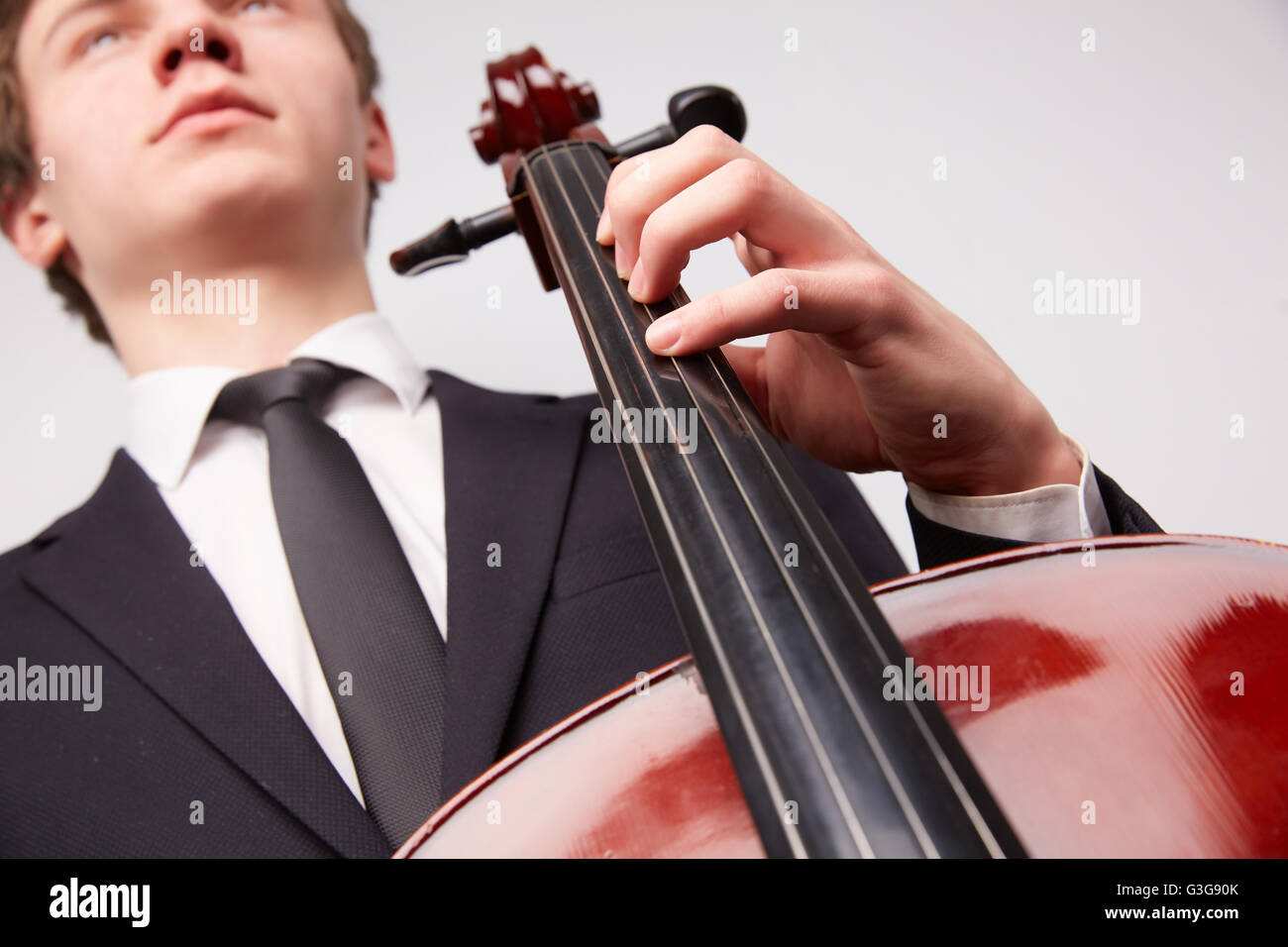 young man with a cello Stock Photo - Alamy