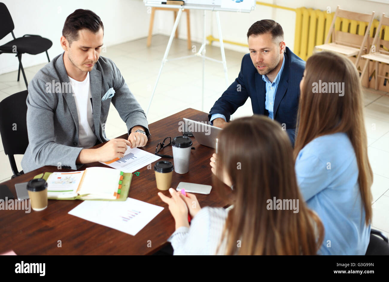 Creative business team working hard together in office Stock Photo - Alamy