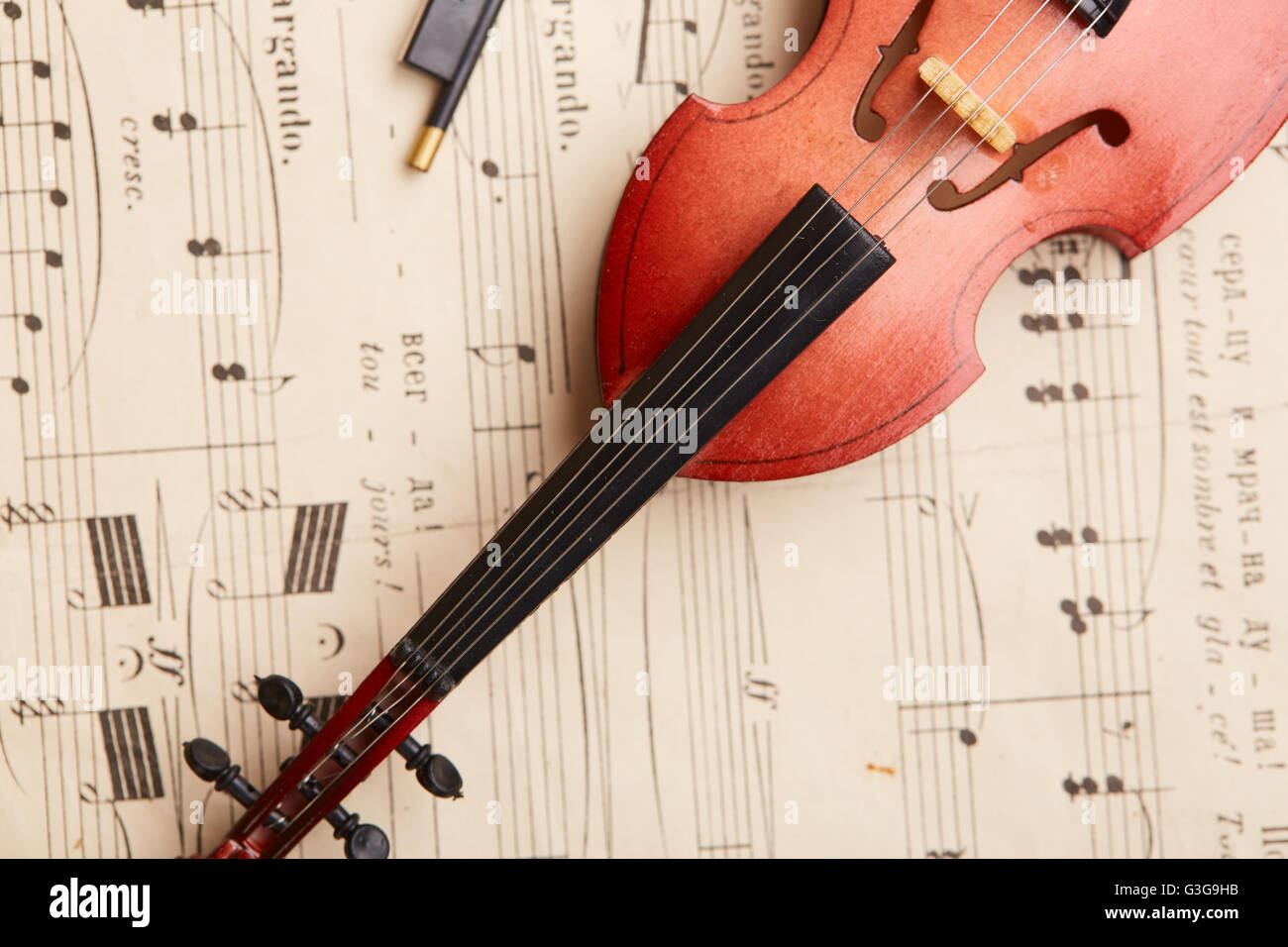 violoncello on of notes background Stock Photo - Alamy