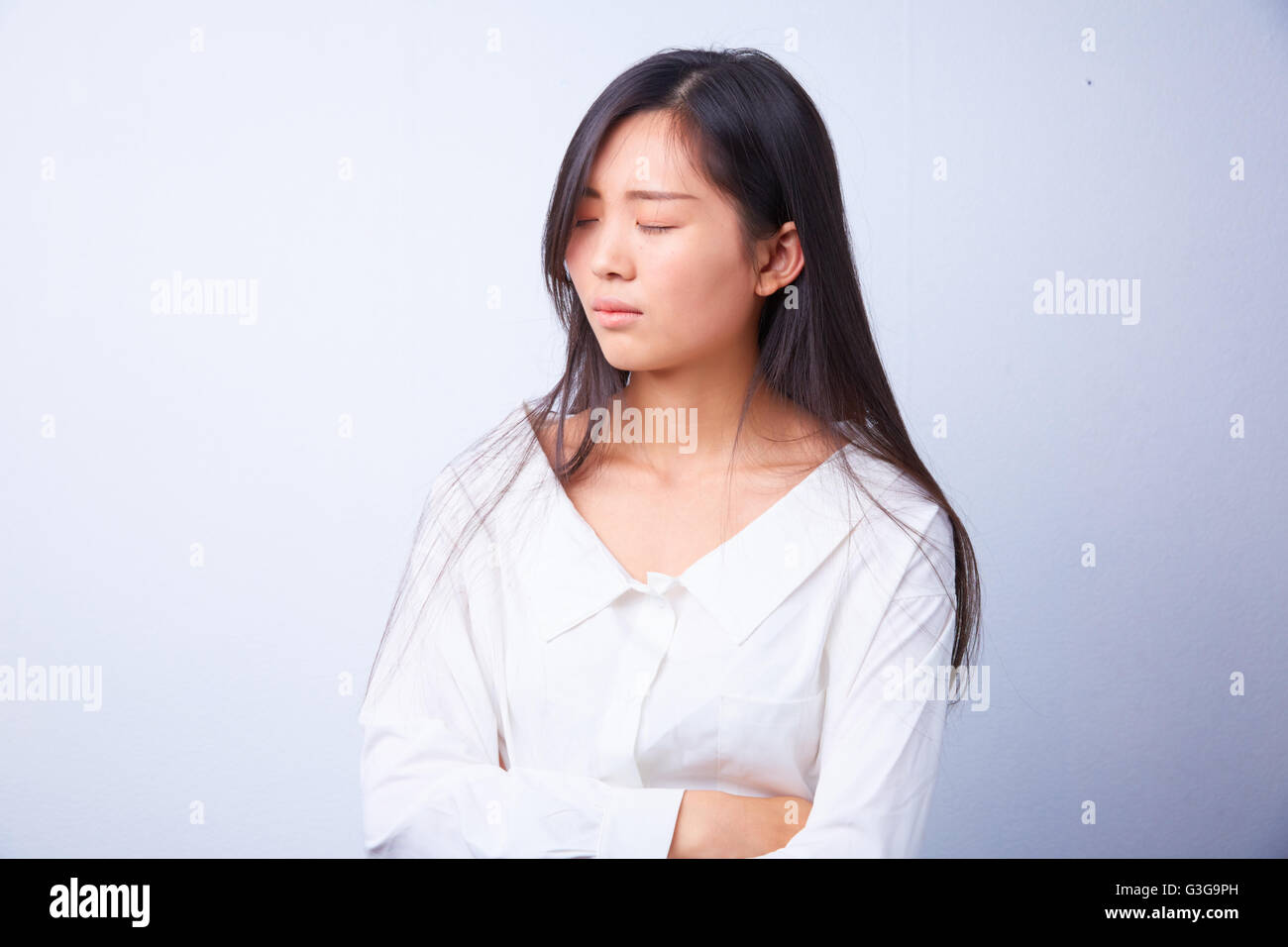sad сhinese woman in white Stock Photo - Alamy