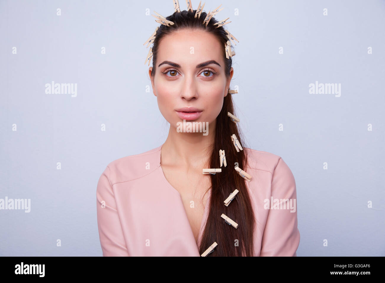 beautiful brunette woman with clothespins in her hair Stock Photo - Alamy