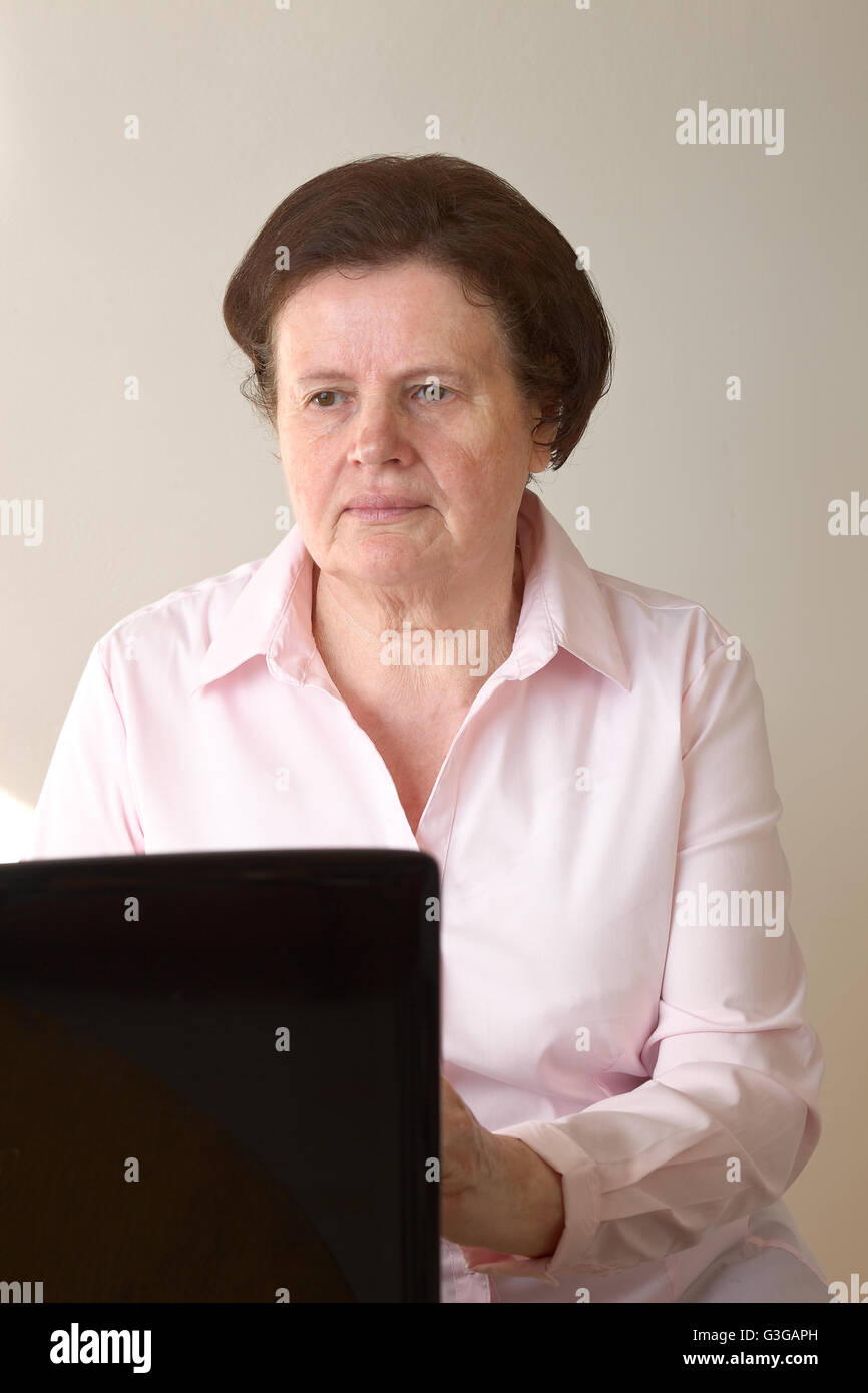 Senior at computer Stock Photo - Alamy