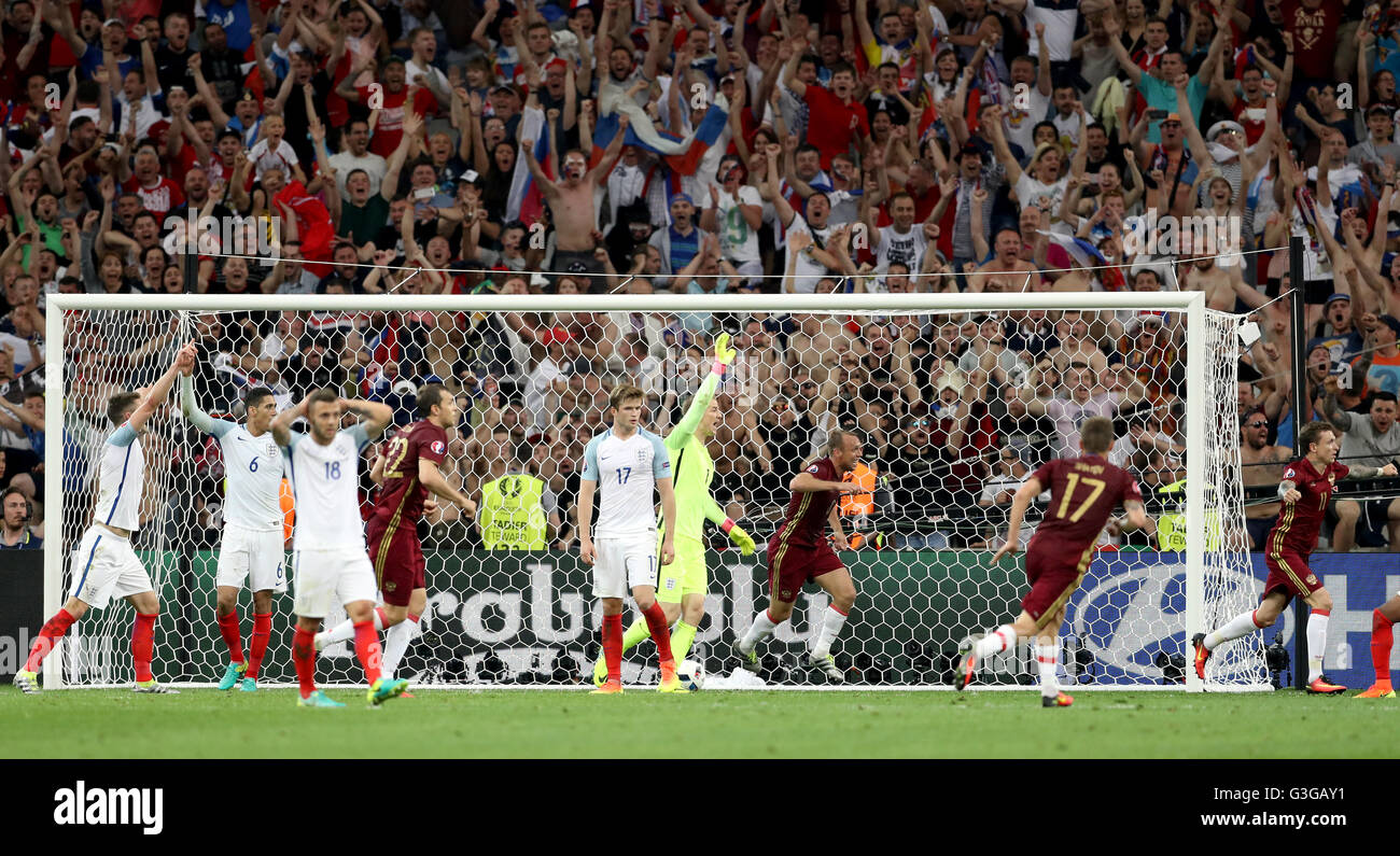 Russia's Denis Glushakov (third right) turns to celebrate after scoring ...