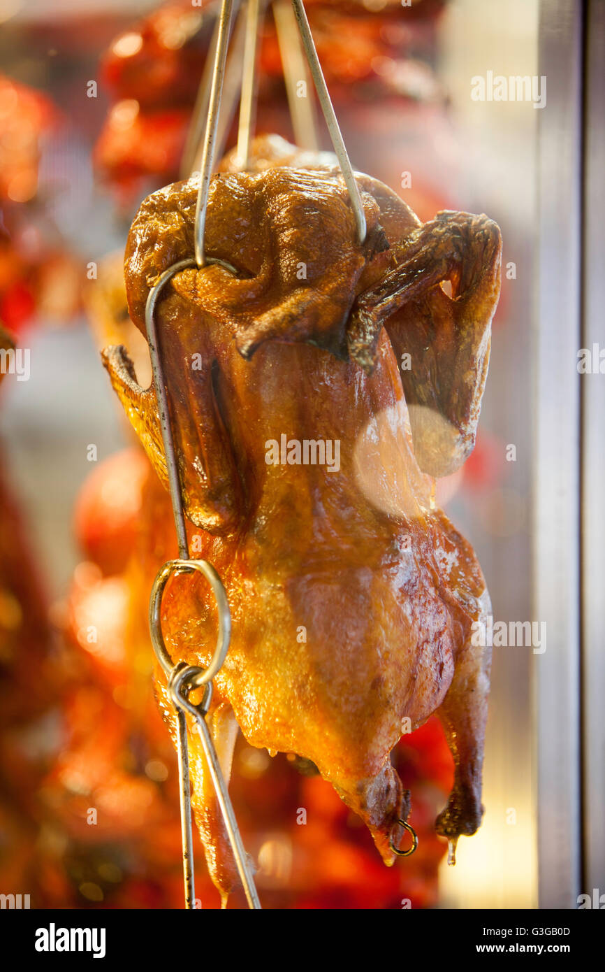 Roasted ducks hanging in window hi-res stock photography and images - Alamy