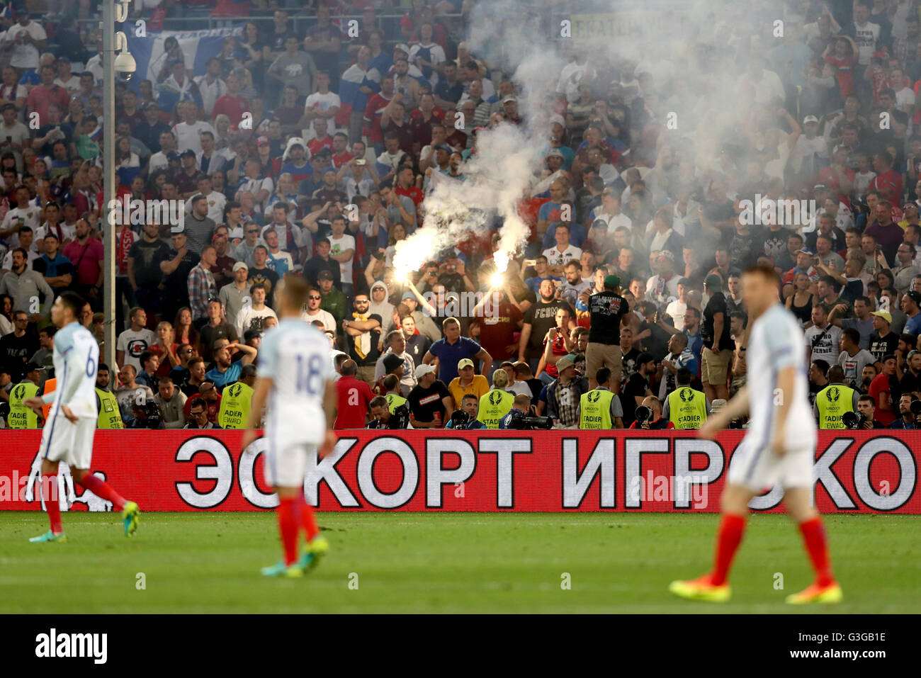 Flares are let off by a fan in the stands during the UEFA Euro 2016 ...