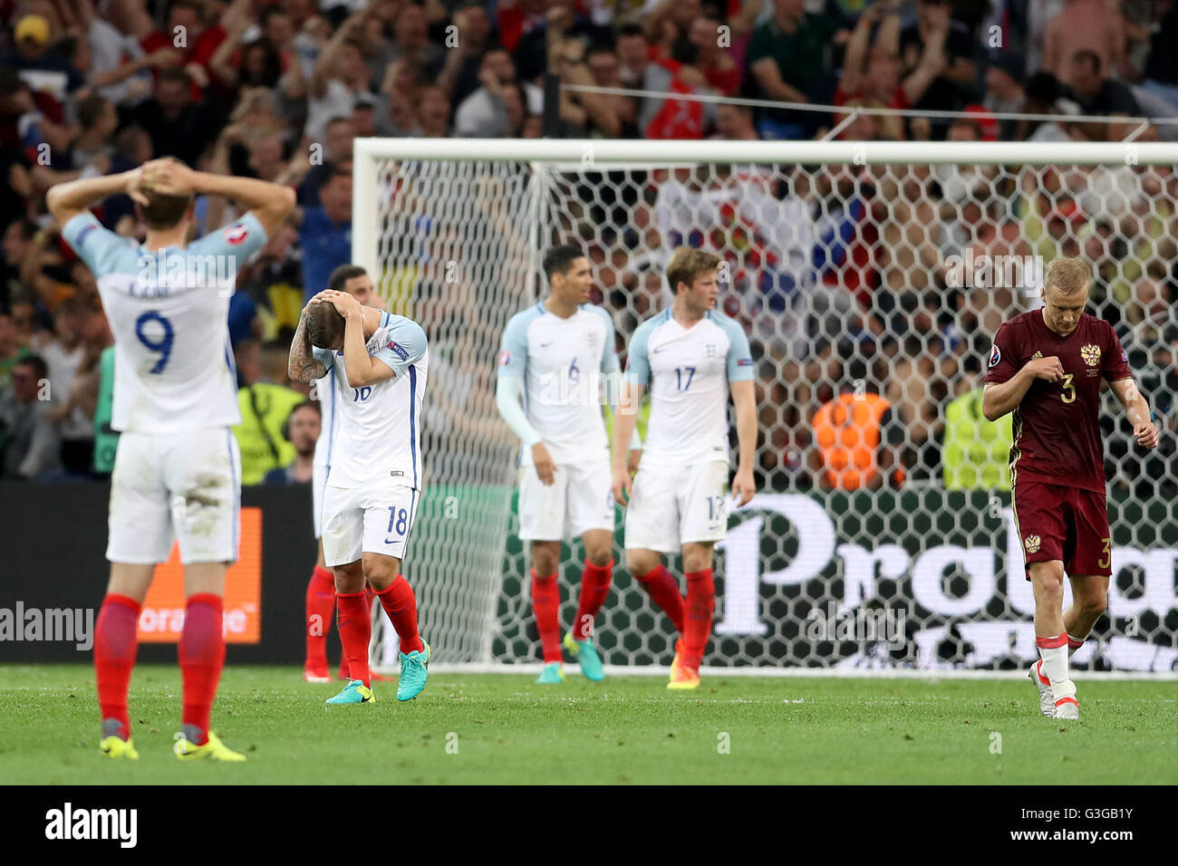 England's Jack Wilshere (second left) stands dejected with team-mates ...