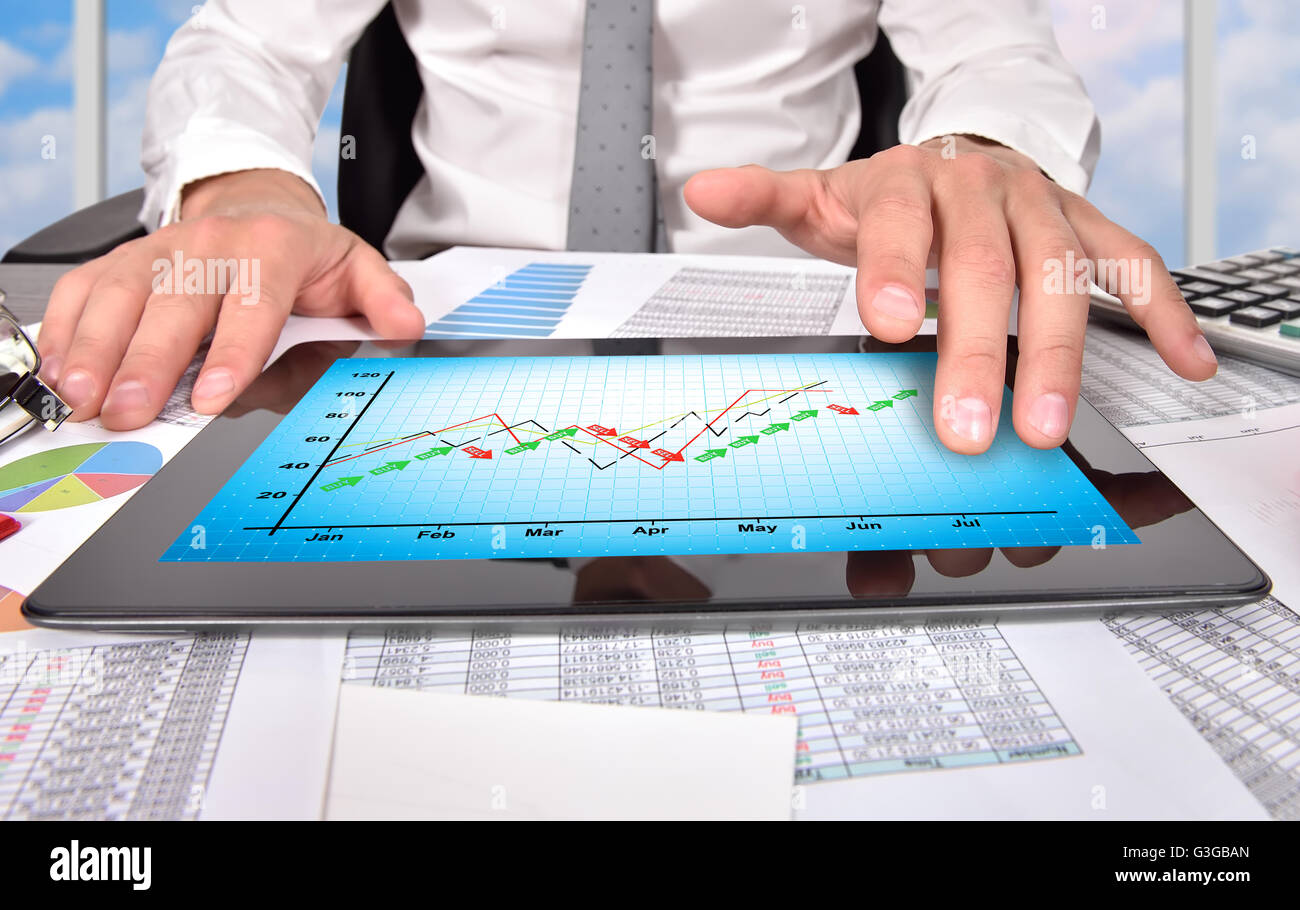hands using digital tablet with stock chart on screen Stock Photo - Alamy