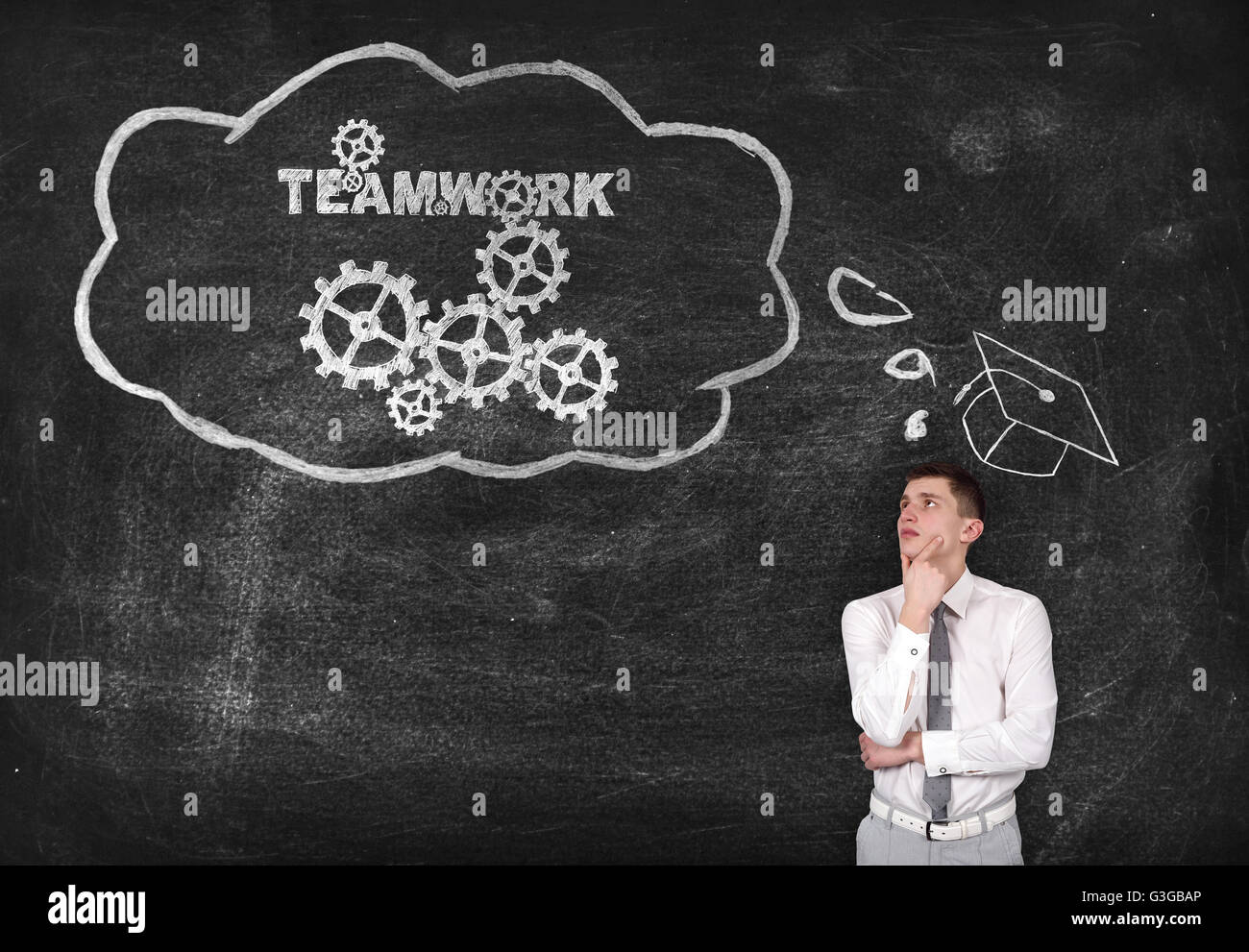 businessman thinks of effective teamwork. drawing teamwork concept on ...