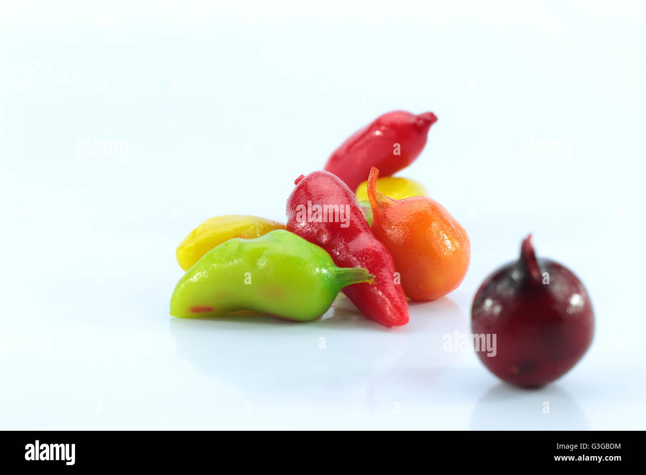 deletable imitation fruits on white background Stock Photo - Alamy