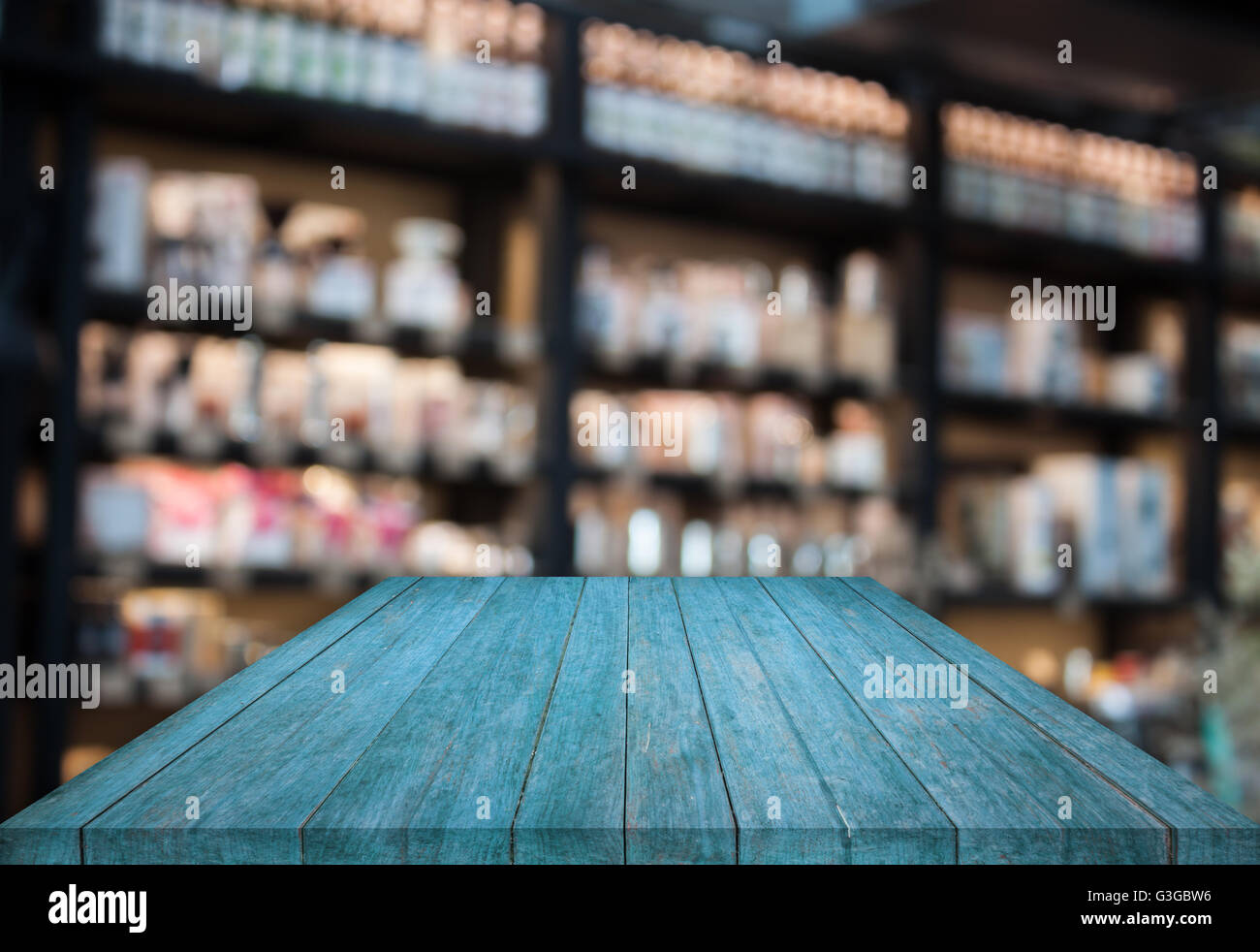Blue tabletop wooden with blurred cafe background. product display ...