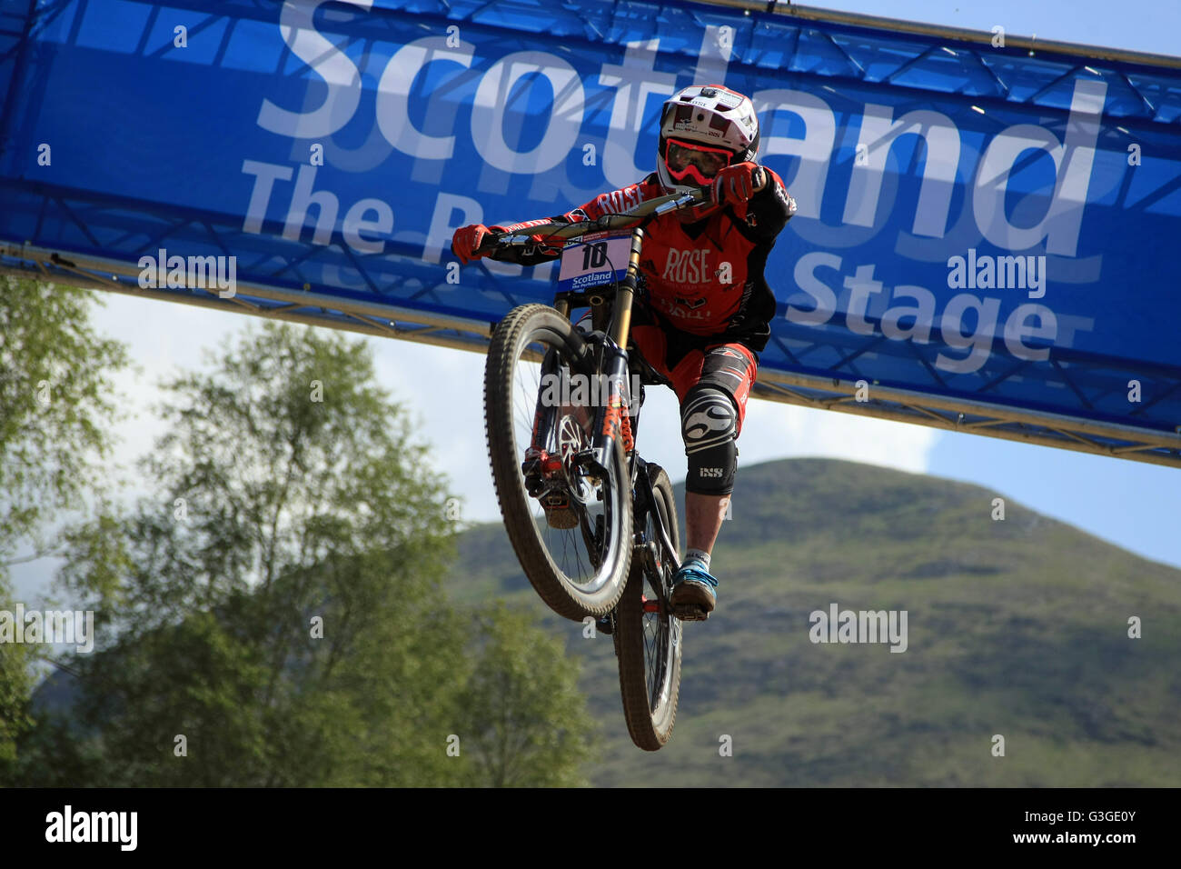Katy Curd jumping through the Scotland Arch at the Downhill Mountain ...