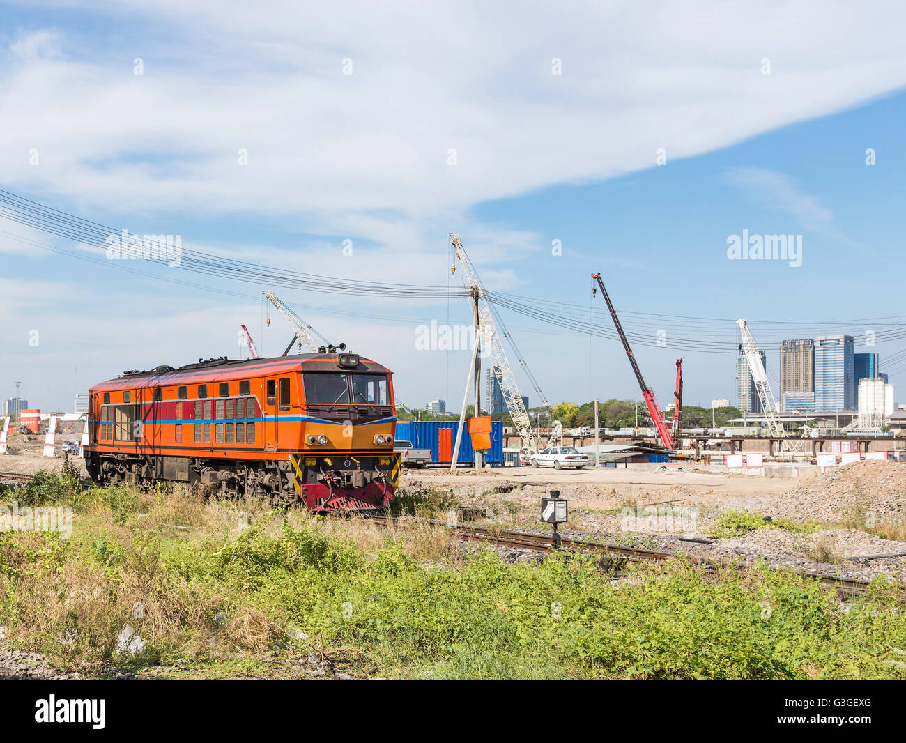 Old diesel electric locomotive is passing the construction site near ...