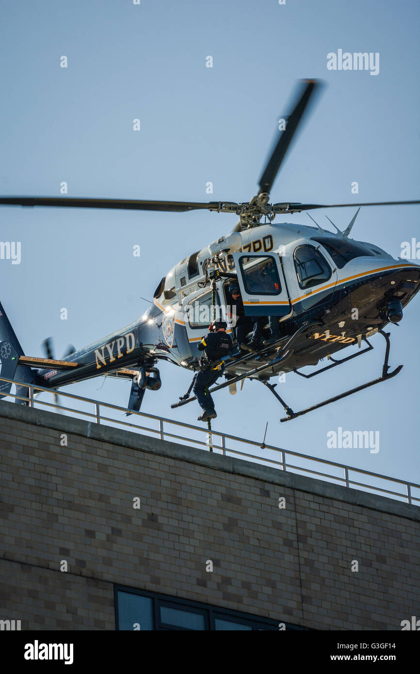 Brooklyn, United States. 15th May, 2016. NYPD Officers repelling from a ...